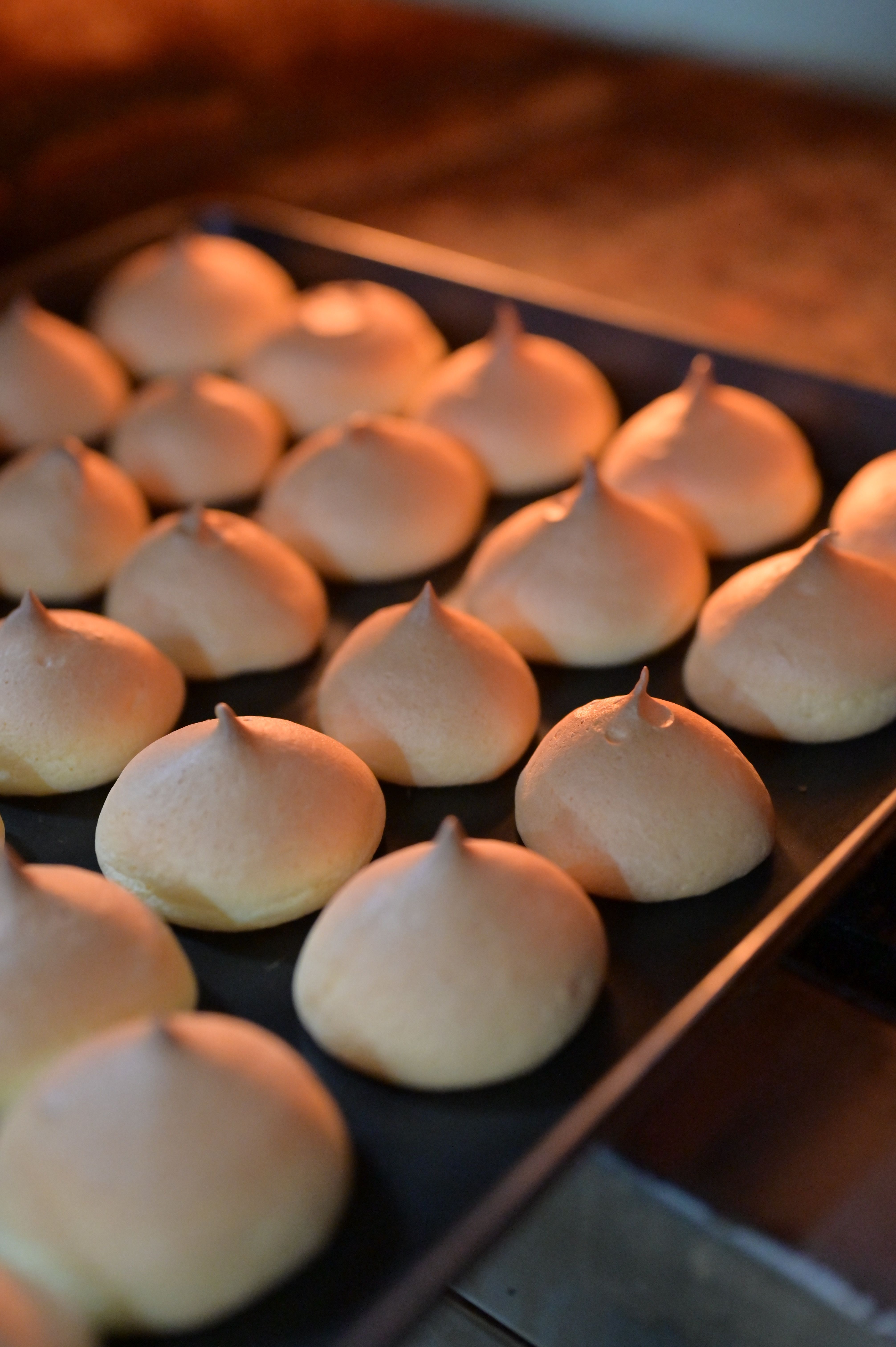 Freshly Baked Meringues Cooling on Tray · Free Stock Photo