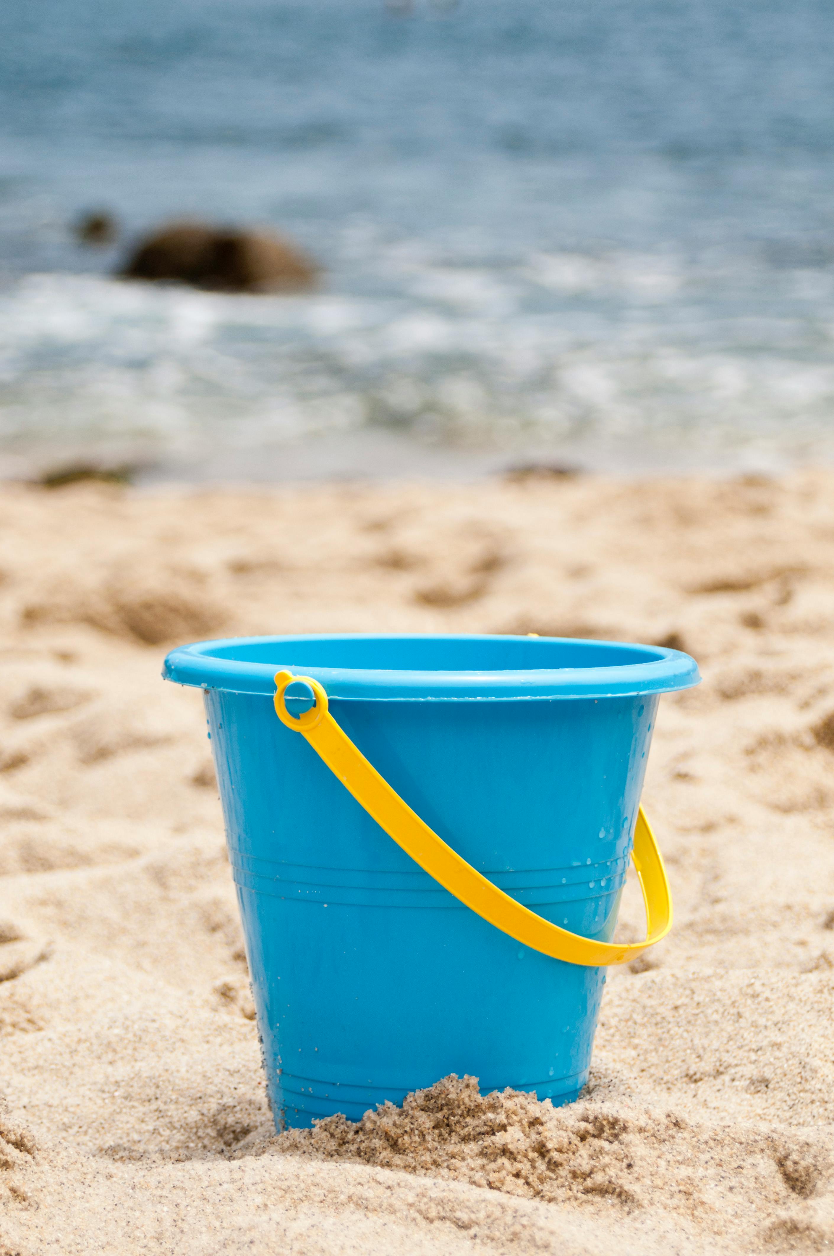 A Bucket on the Sand · Free Stock Photo
