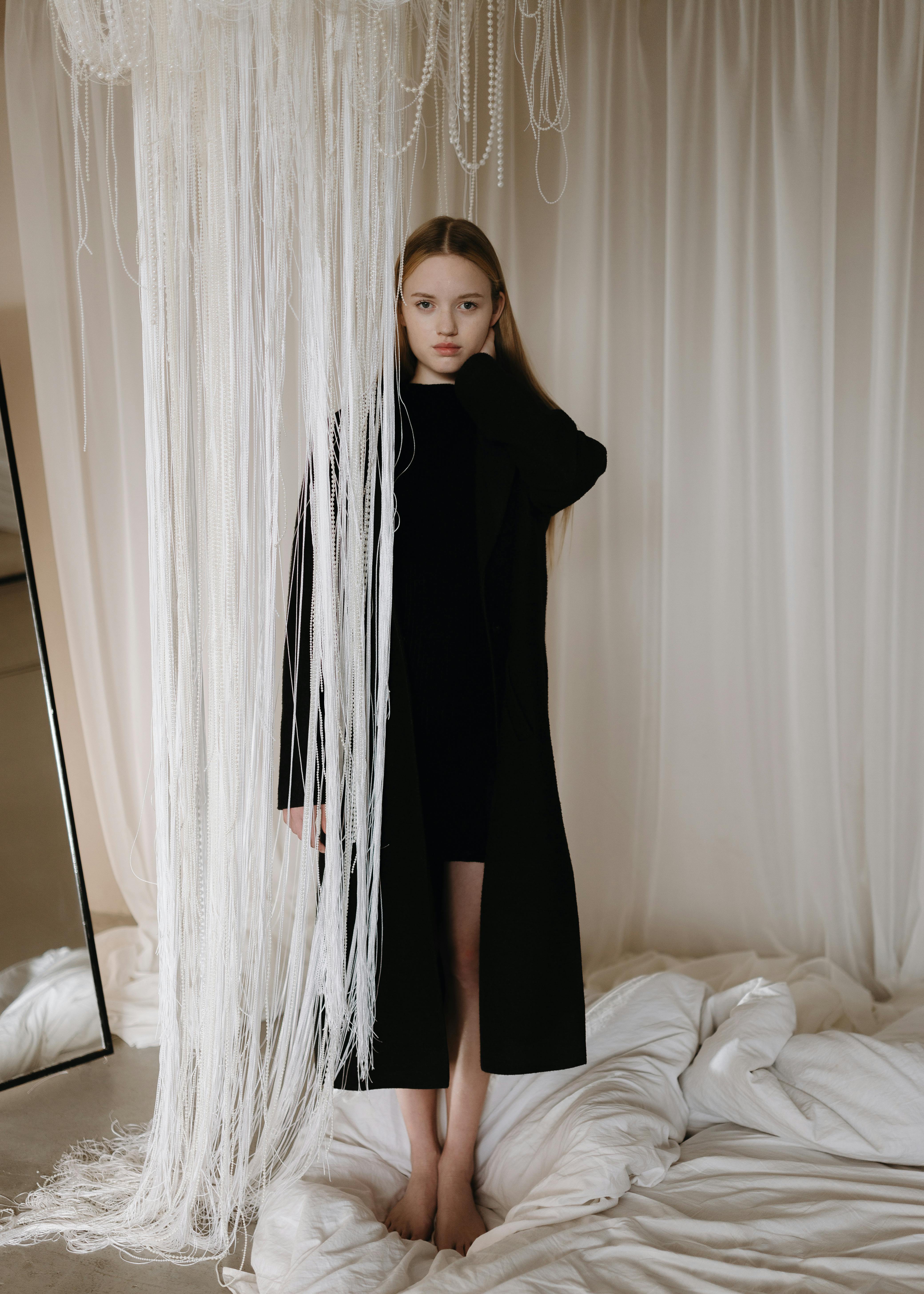 Artistic Portrait of Woman with Draping Curtains · Free Stock Photo