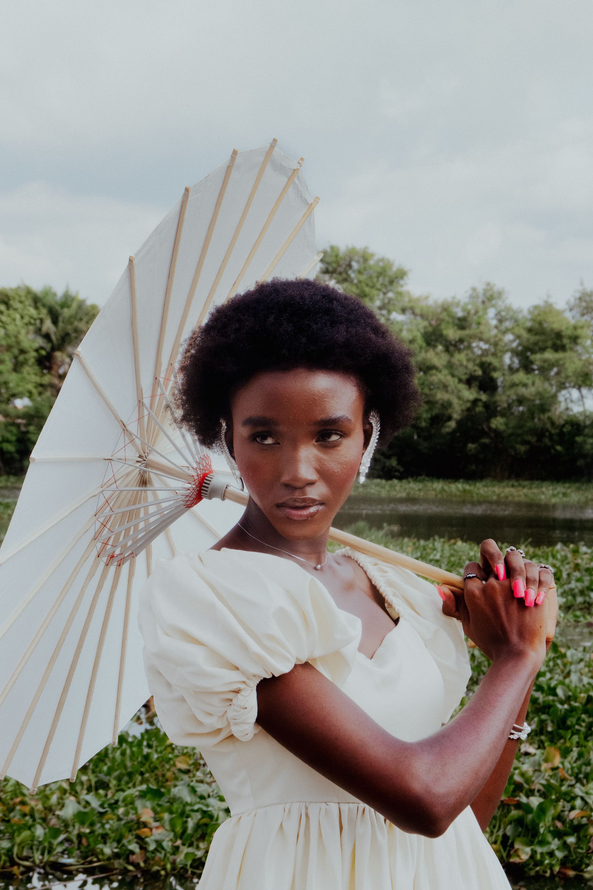 Elegant African Woman with Parasol in Nature · Free Stock Photo