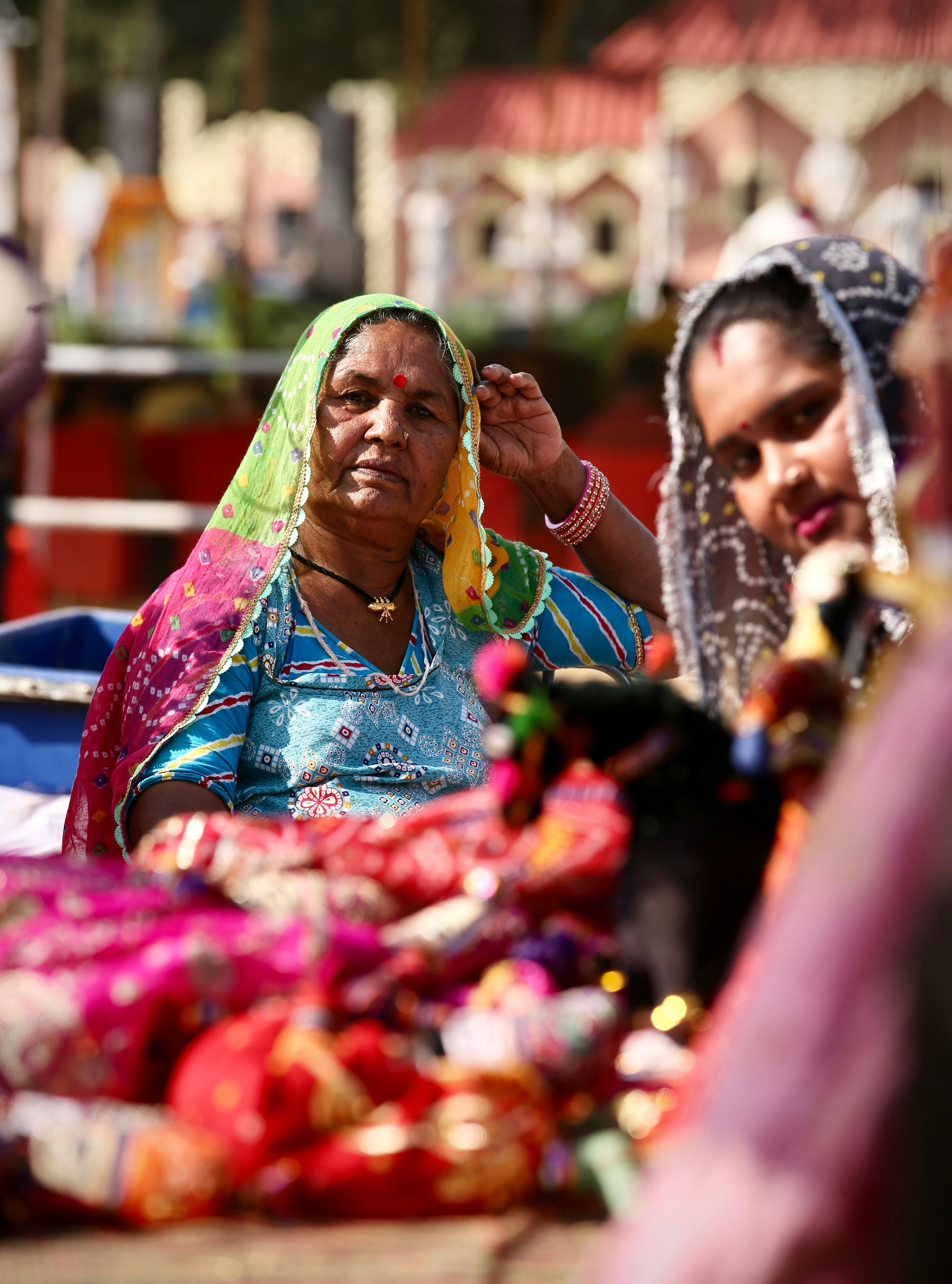 Colorful Traditional Market Scene with Women in Veils · Free Stock Photo