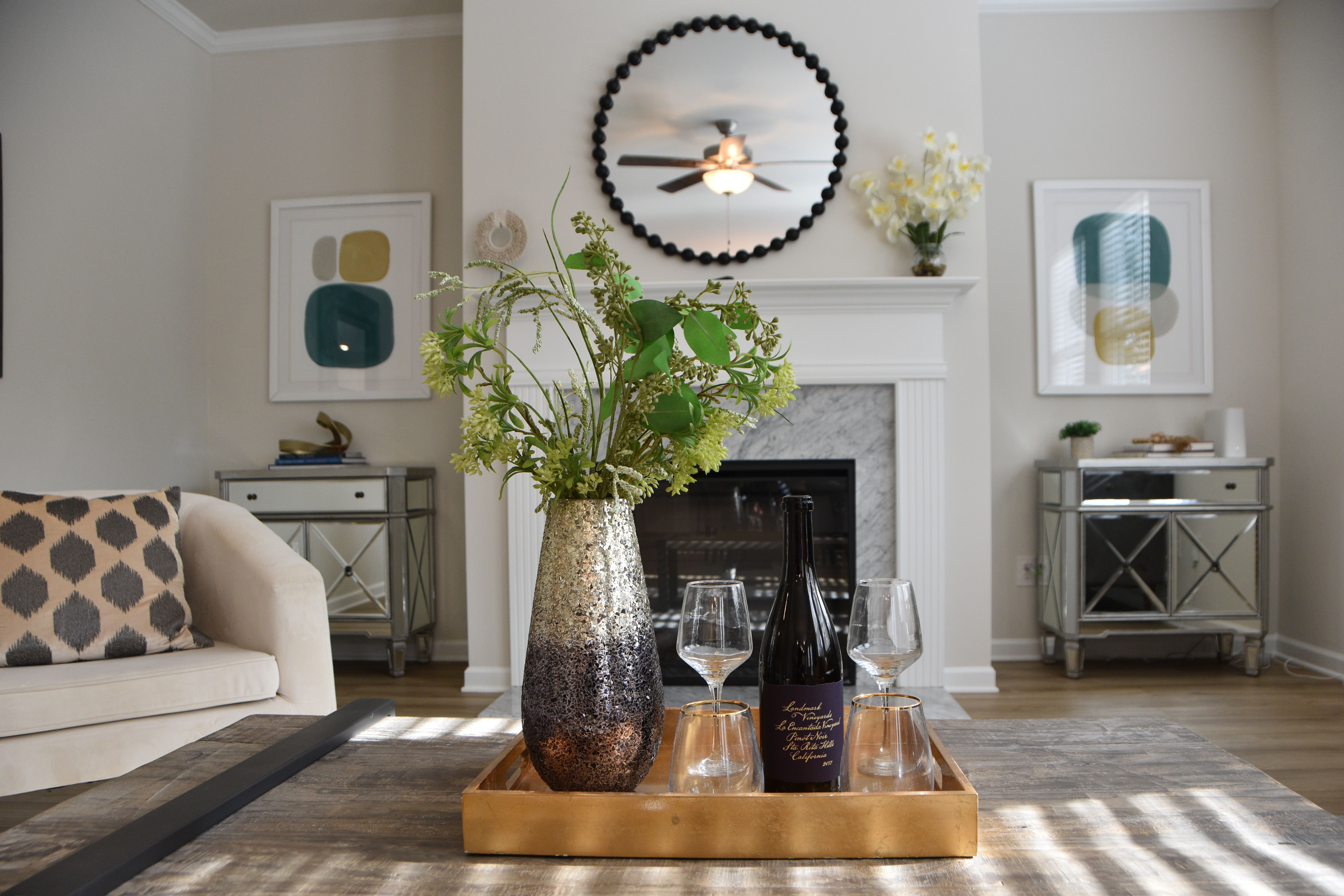 Elegant Living Room with Stylish Decor and Mirror · Free Stock Photo