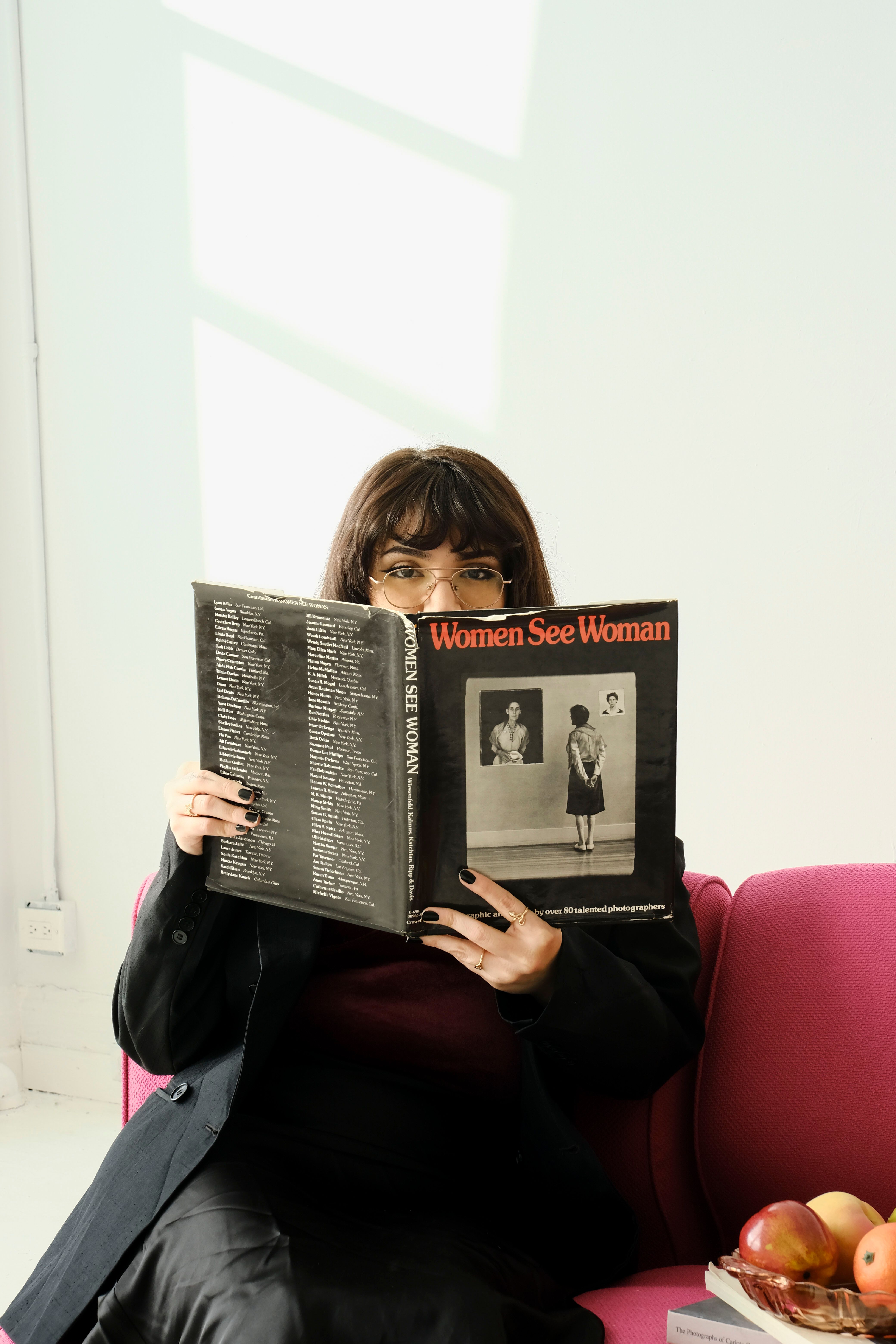 Woman Reading Feminist Literature Indoors · Free Stock Photo