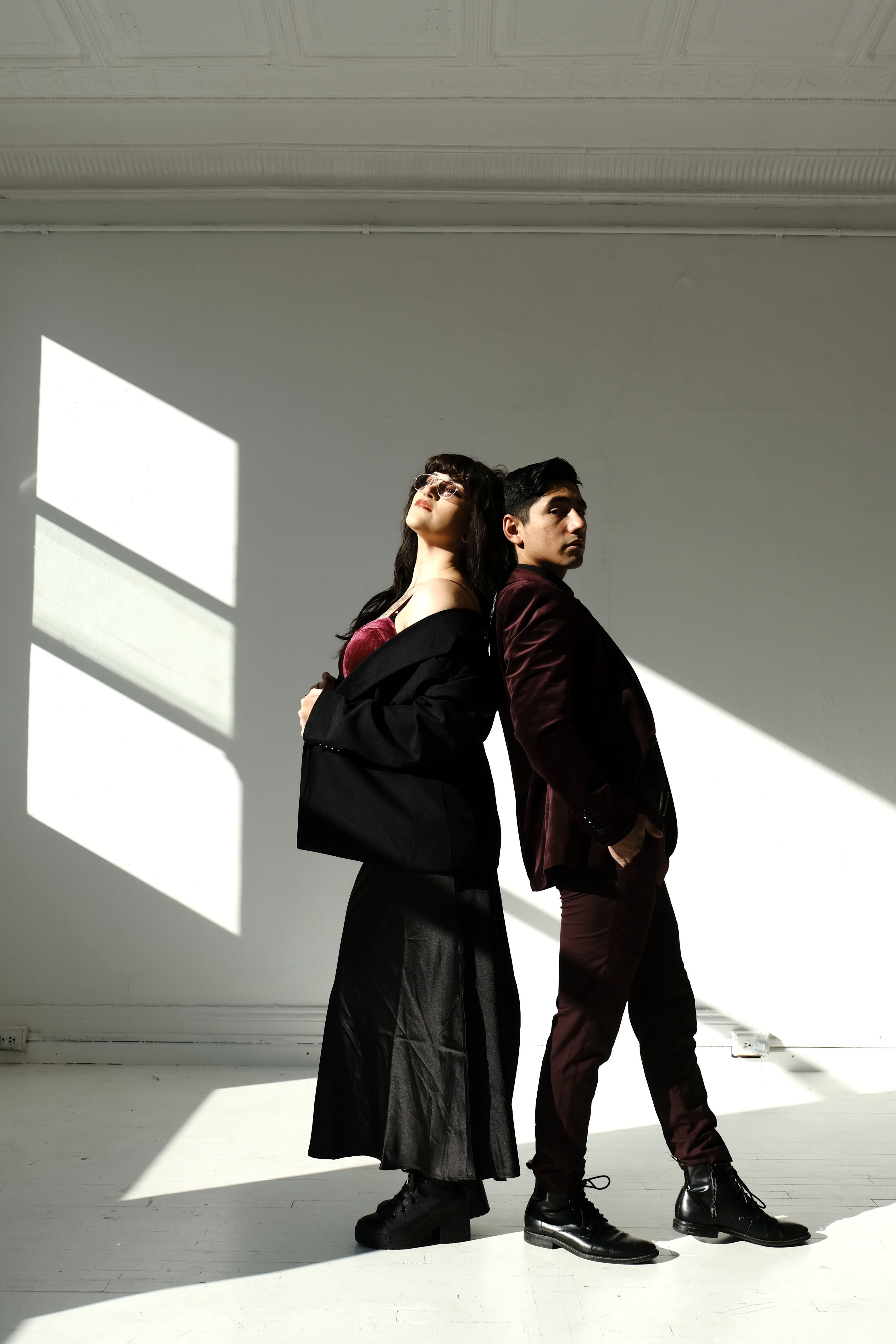 Stylish Couple in Dramatic Studio Lighting · Free Stock Photo