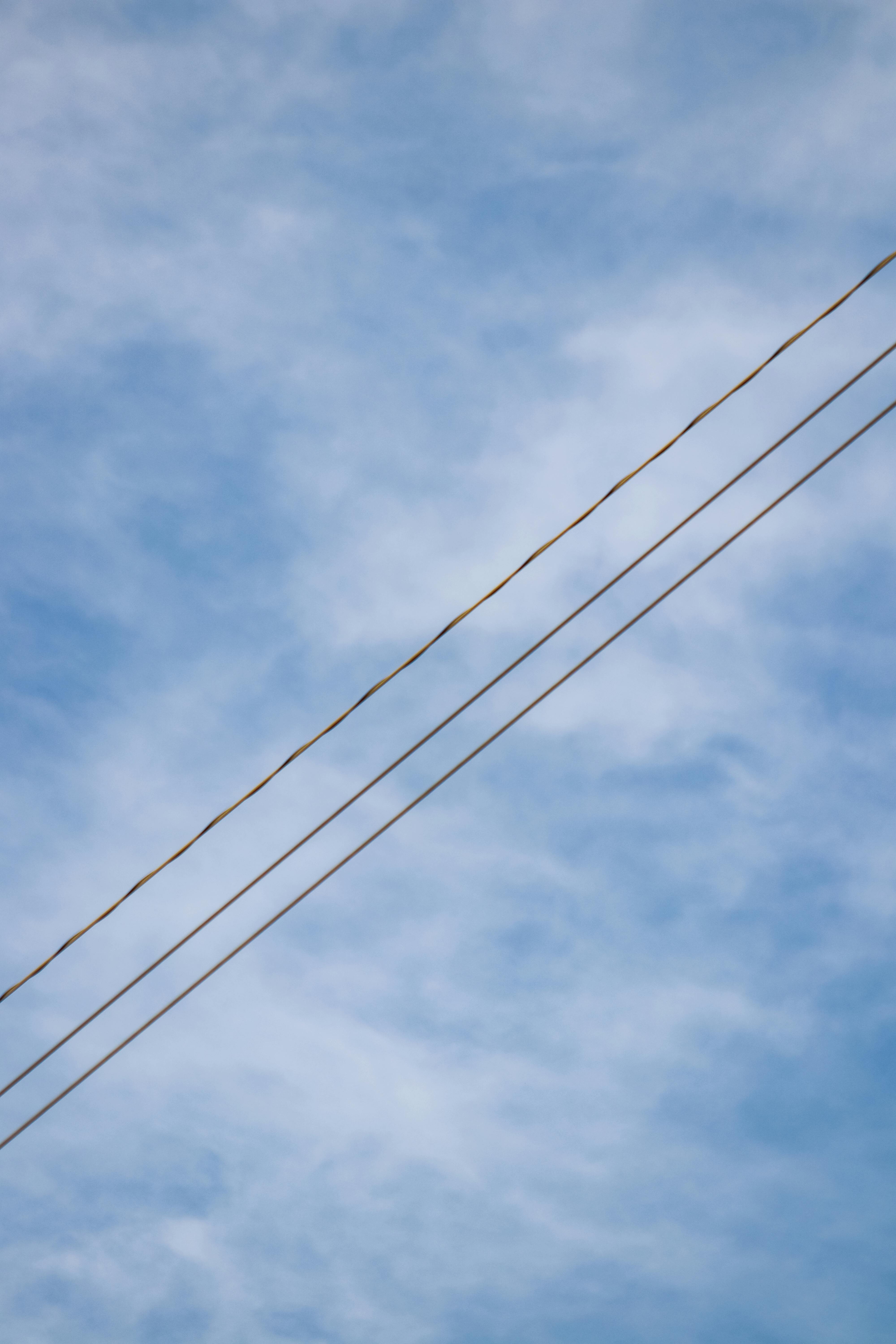 Minimalist Sky with Power Lines Artfully Captured · Free Stock Photo