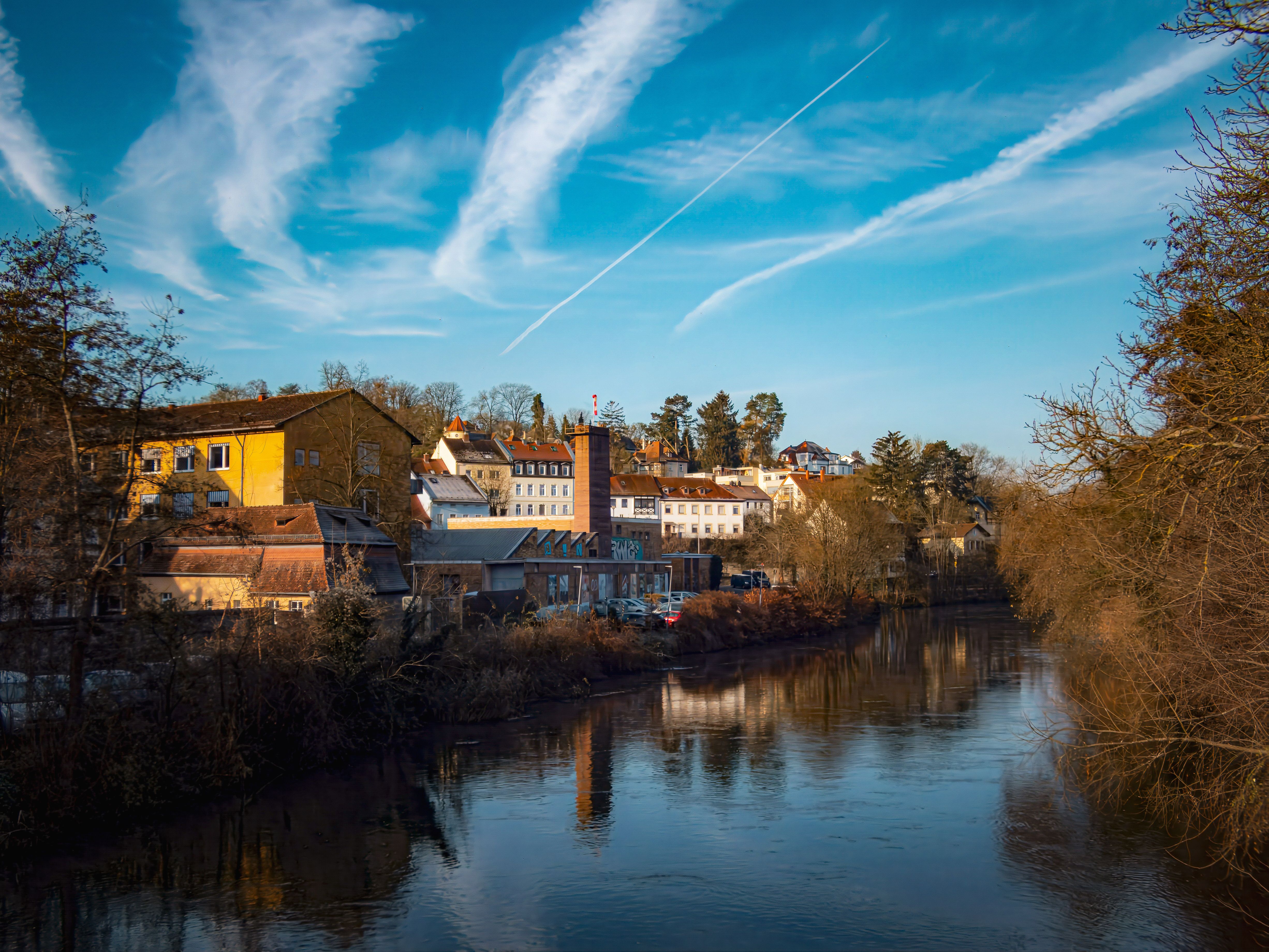 Charming Riverside Village in Peaceful Scenery · Free Stock Photo