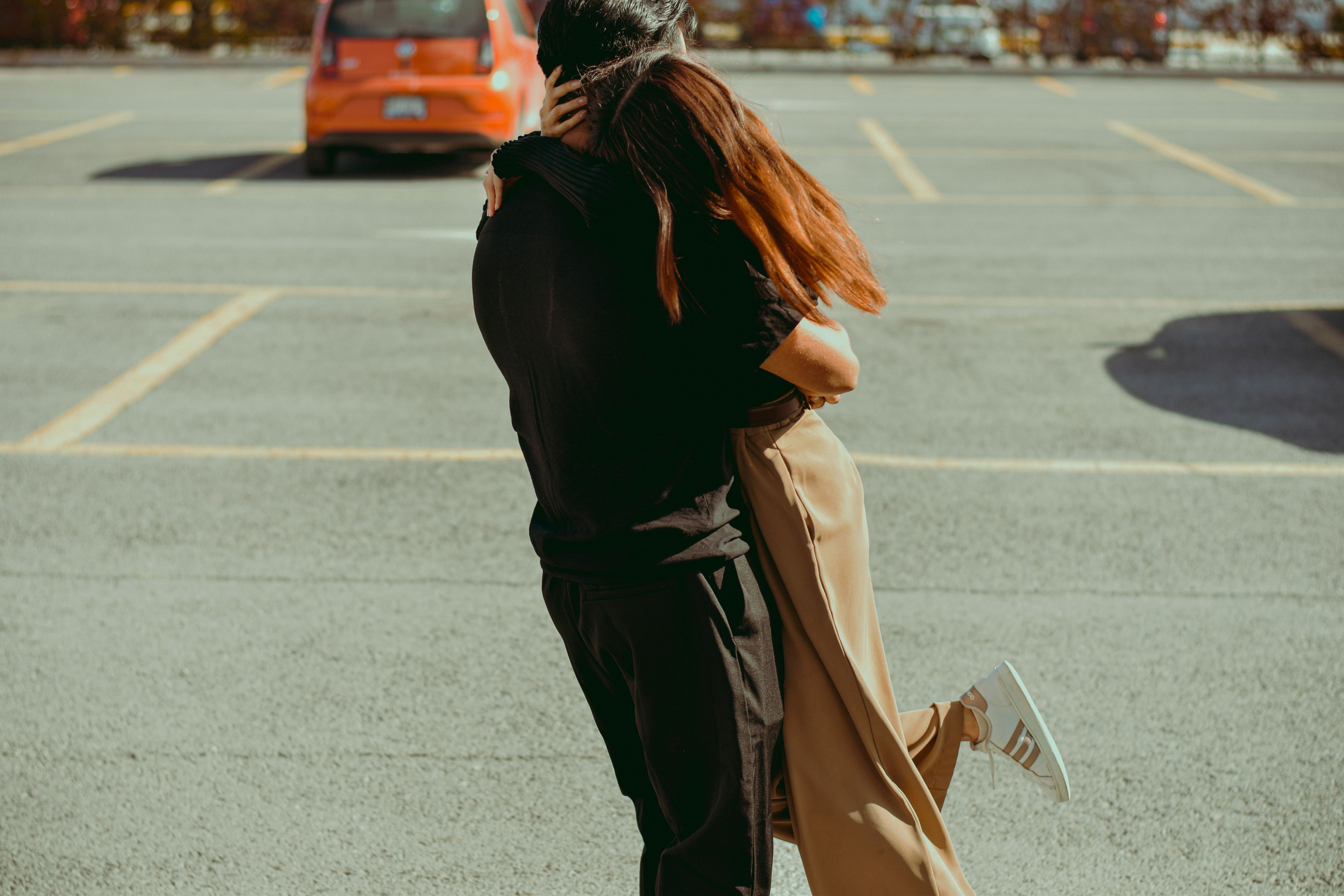 Romantic Hug in an Empty Parking Lot · Free Stock Photo