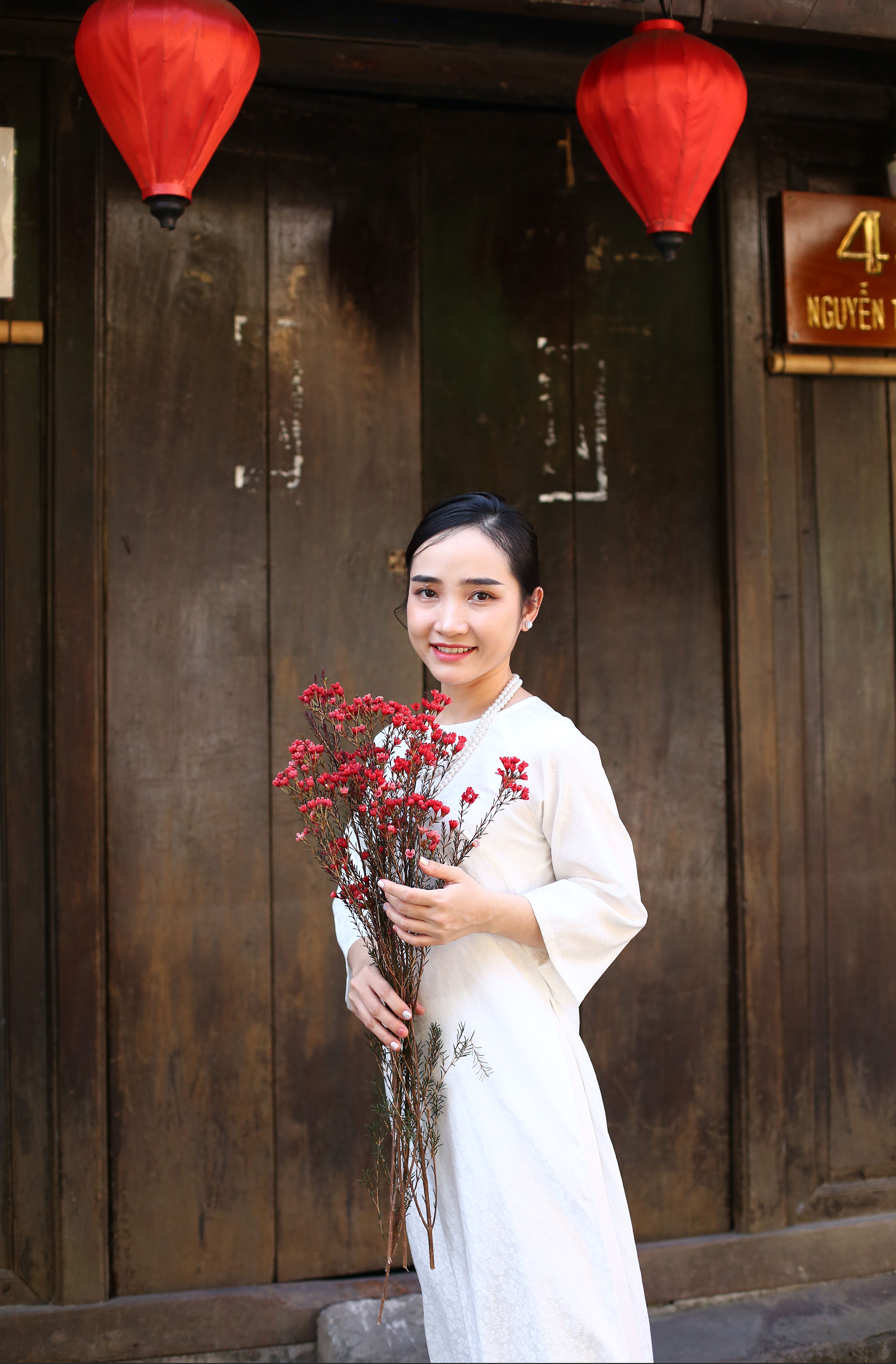 Woman in Red Traditional Dress at Vietnamese Cafe · Free Stock Photo