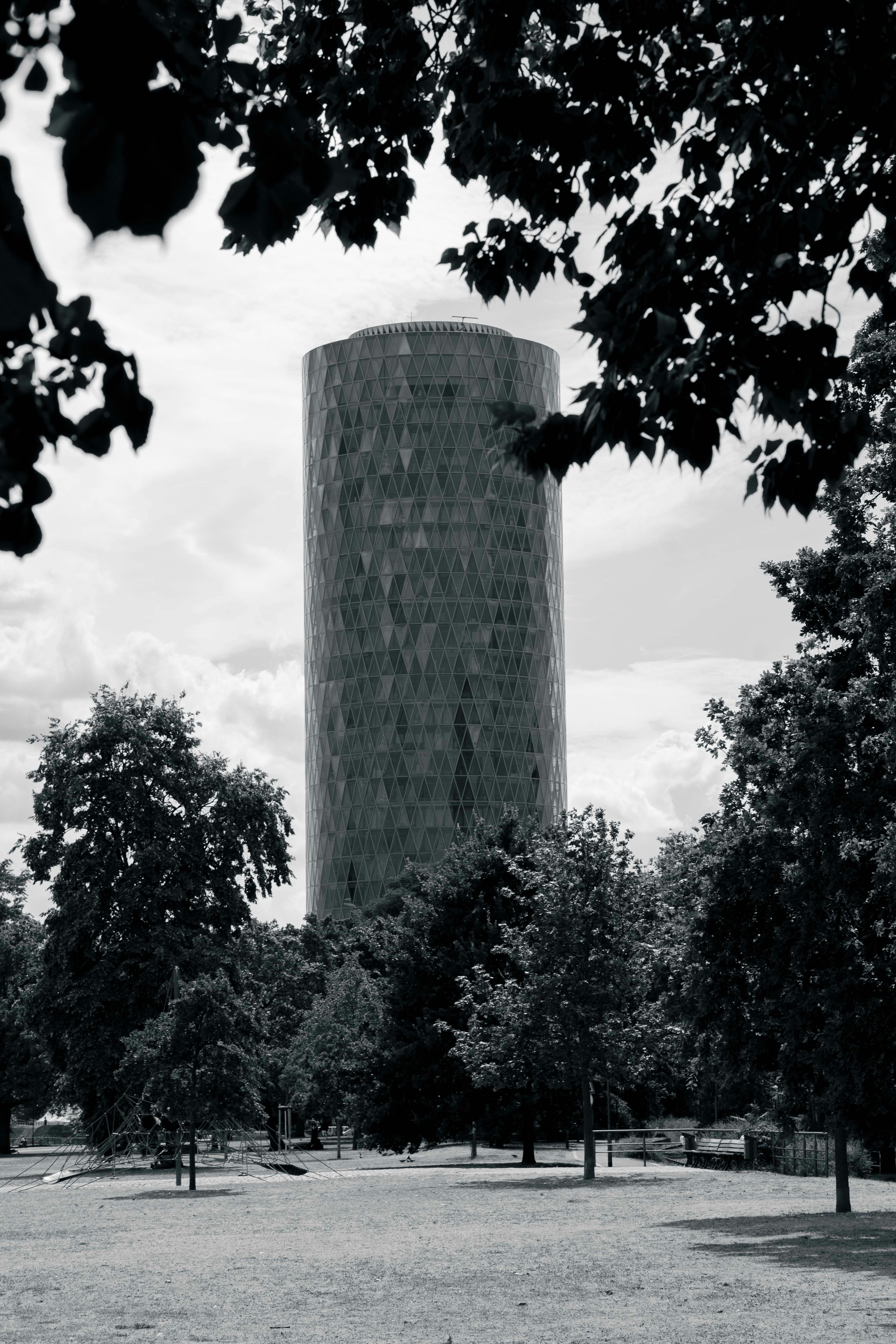 Modern Cylindrical Tower in Urban Park Setting · Free Stock Photo