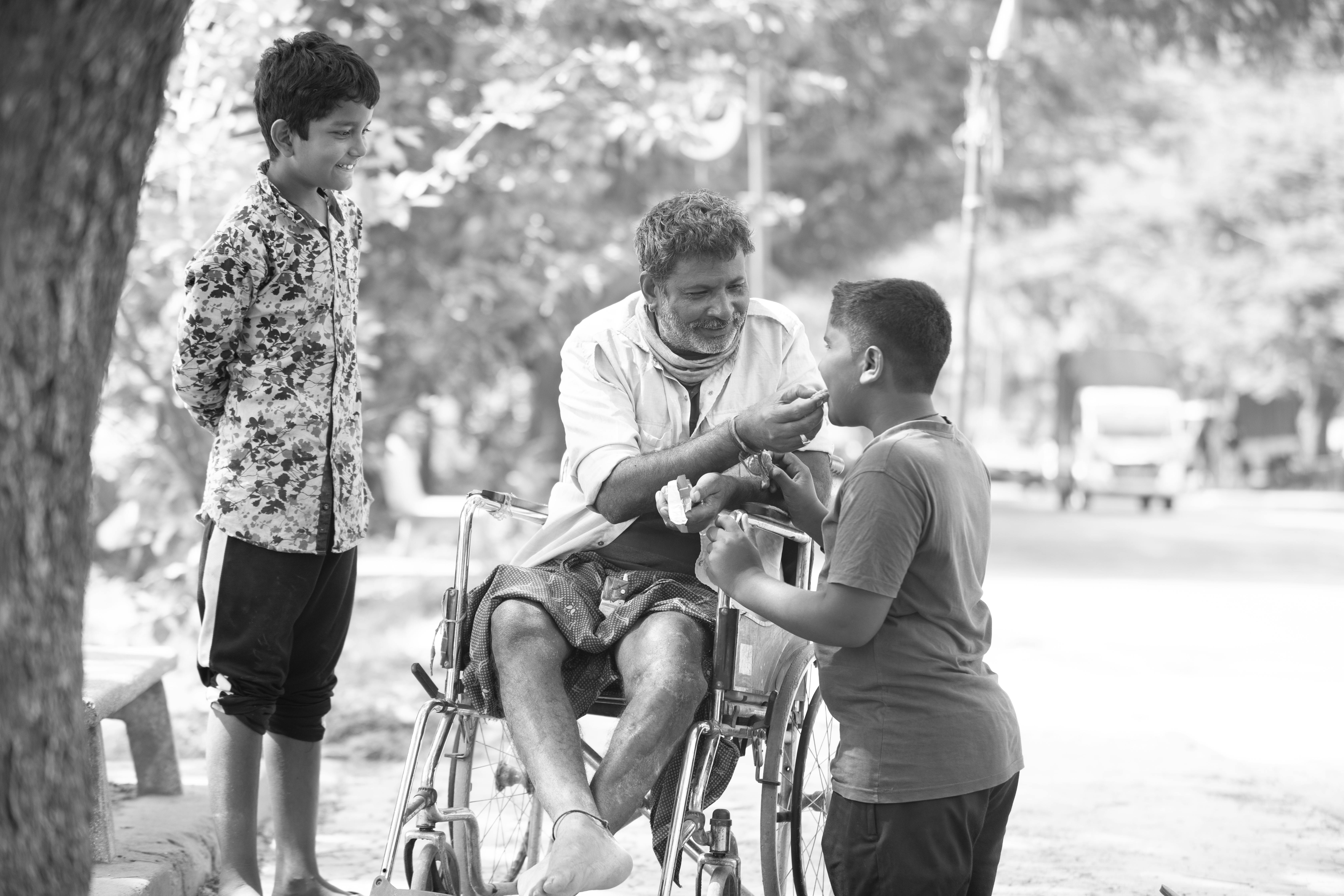 Compassionate Interaction Outdoors in Black and White · Free Stock Photo