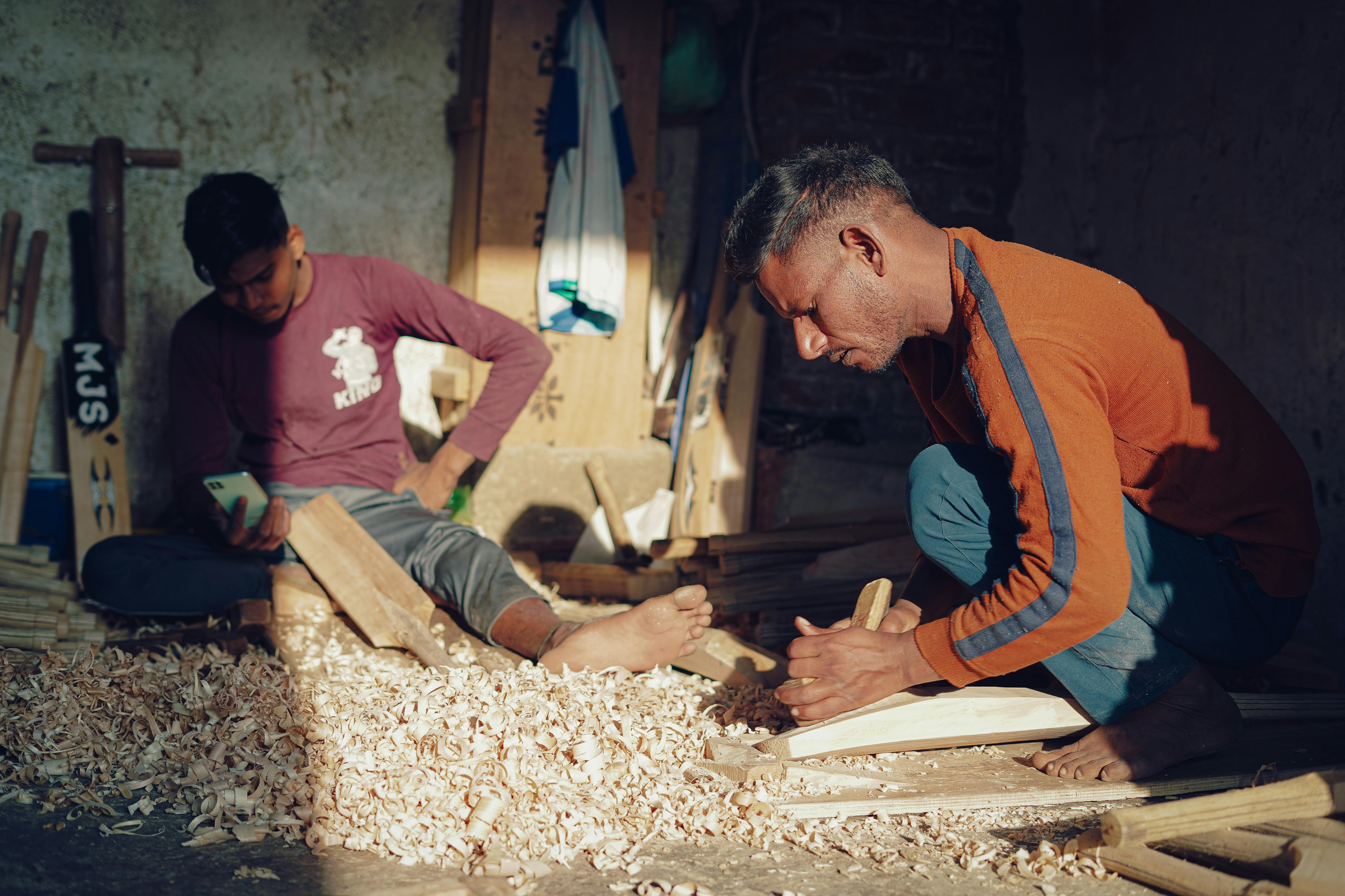 Craftsmen Working on Wood with Traditional Tools · Free Stock Photo