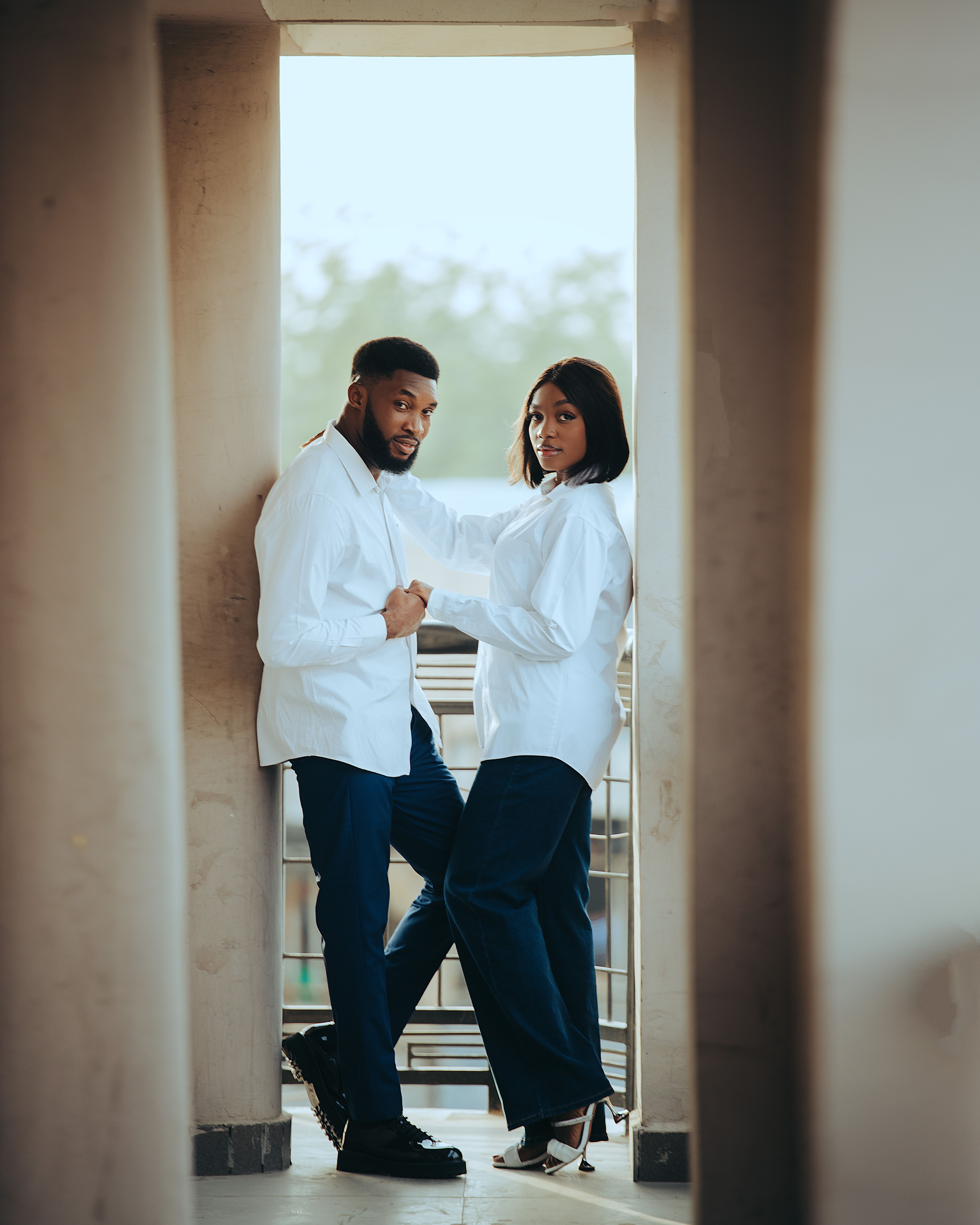 Stylish Couple Posing in Modern Urban Setting · Free Stock Photo