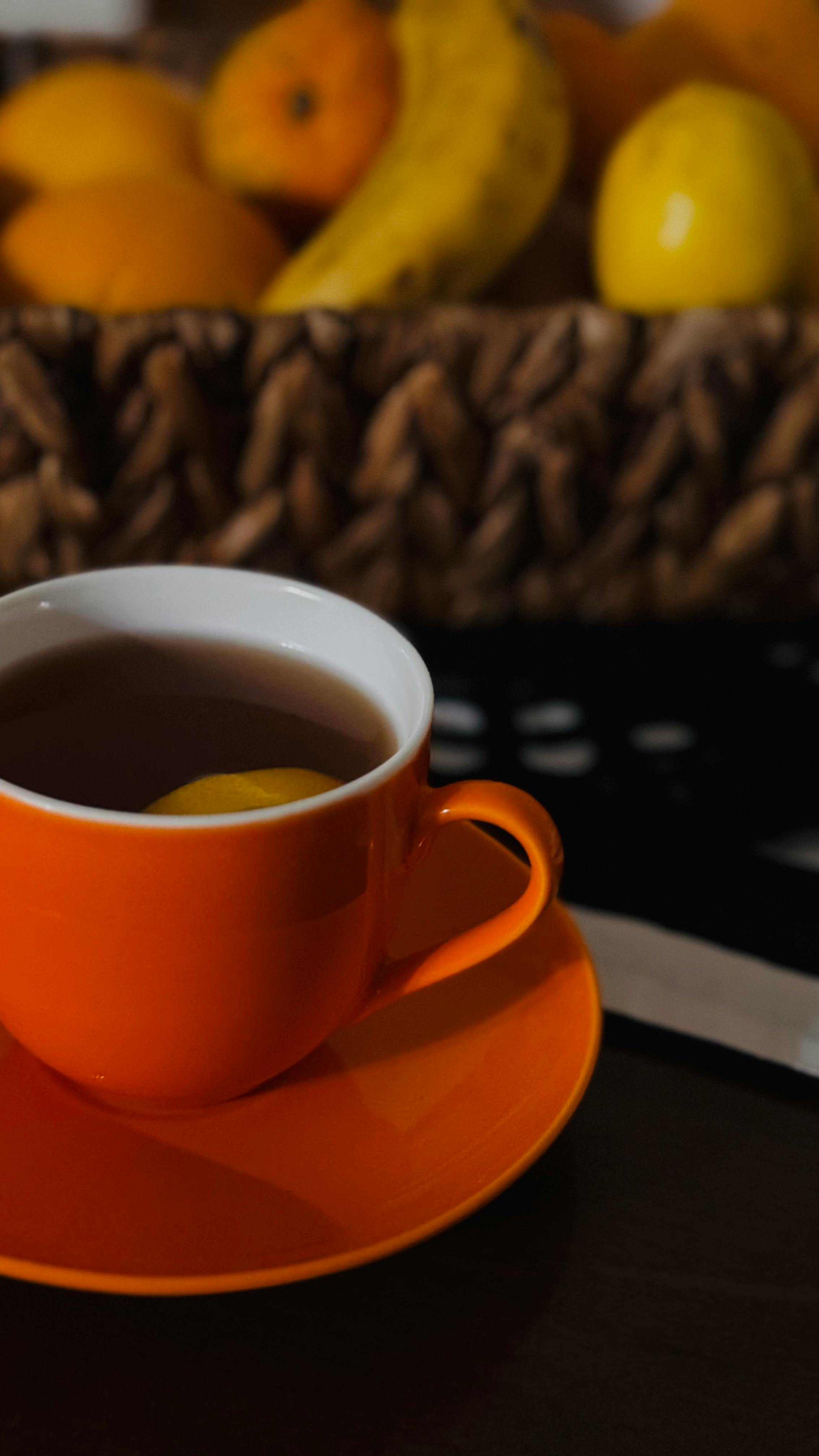 Orange Tea Cup with Lemon and Fruit Basket · Free Stock Photo