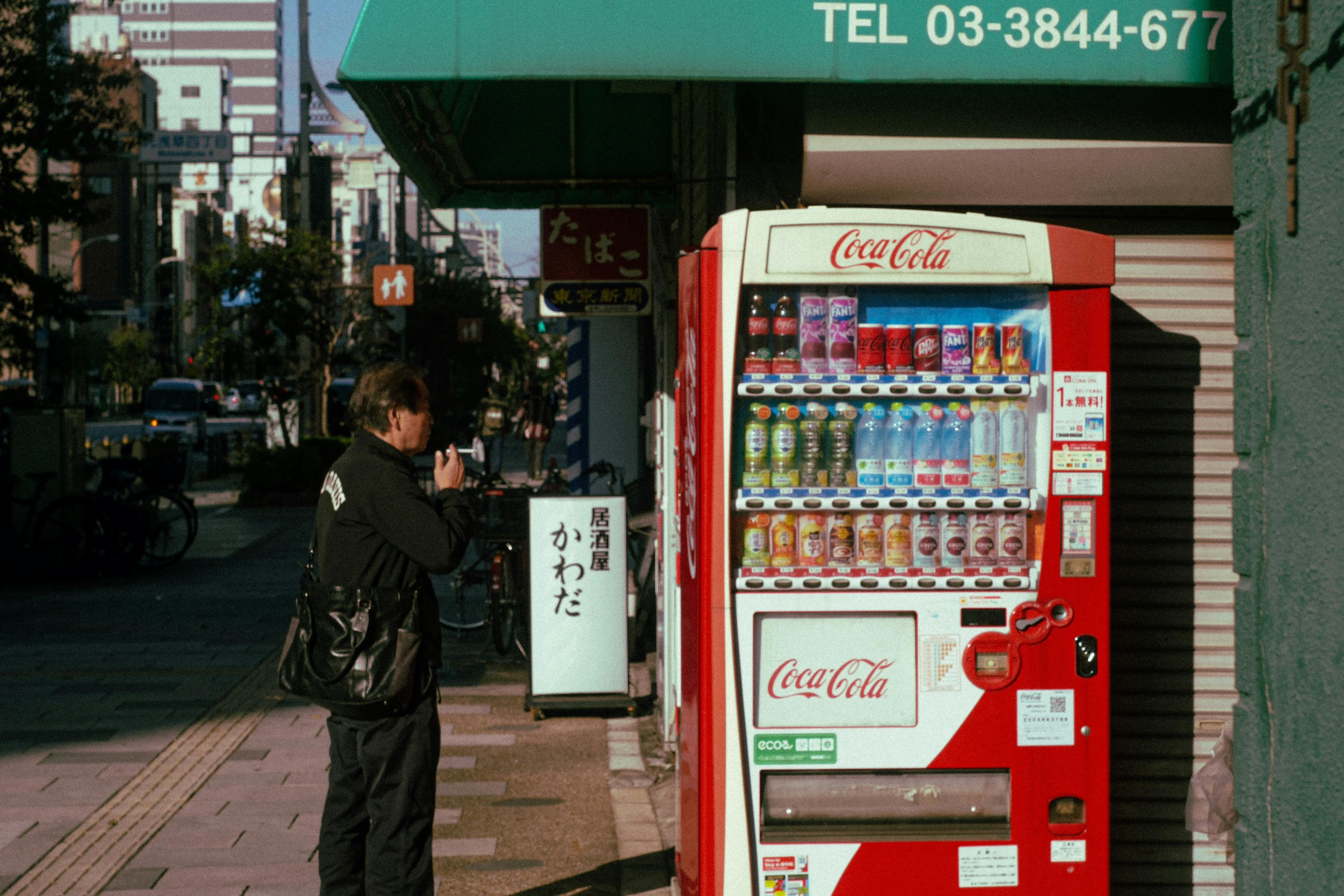 Urban Tokyo Street with Vending Machine and Pedestrian · Free Stock Photo