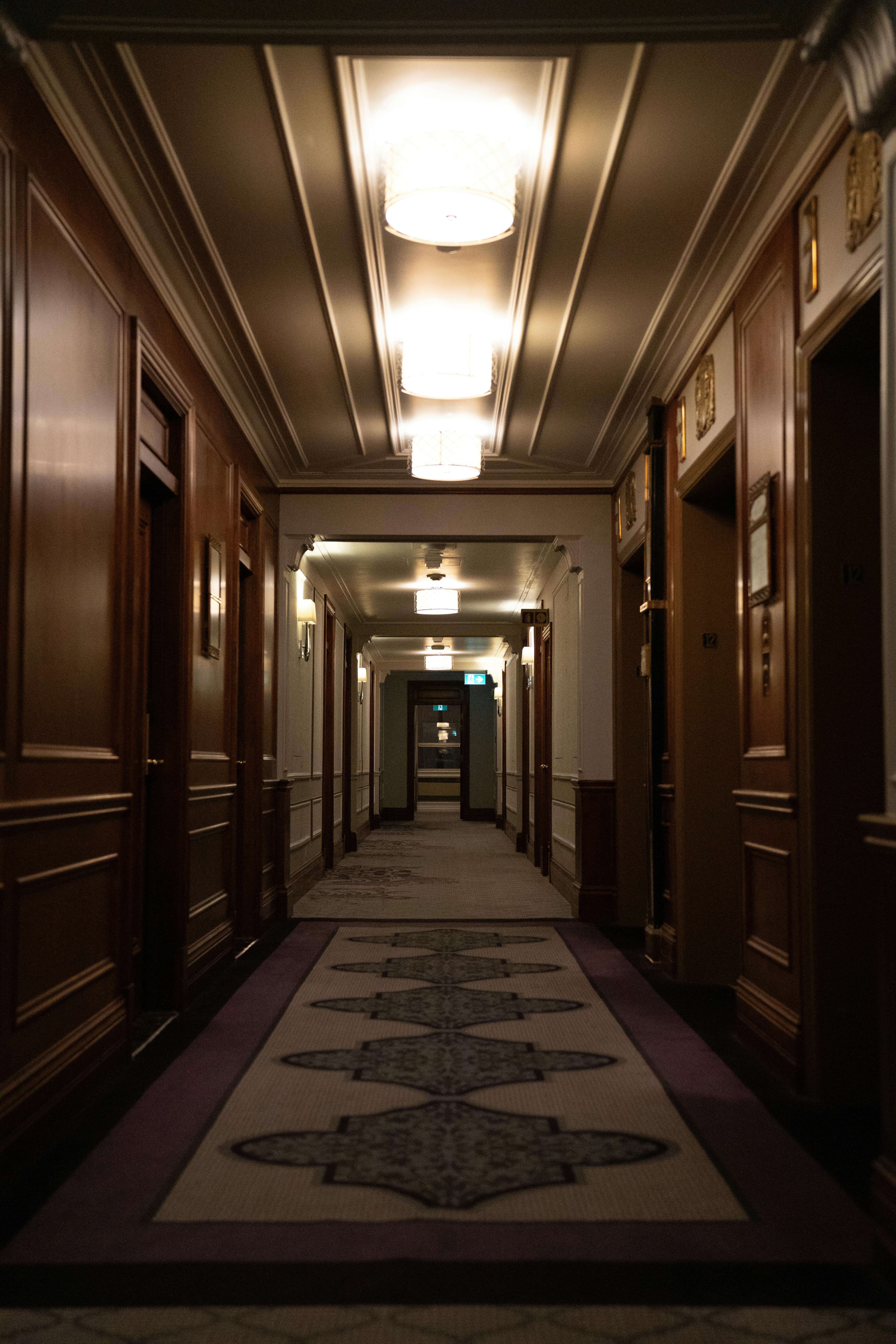 Elegant Hotel Hallway with Rich Wooden Finish · Free Stock Photo