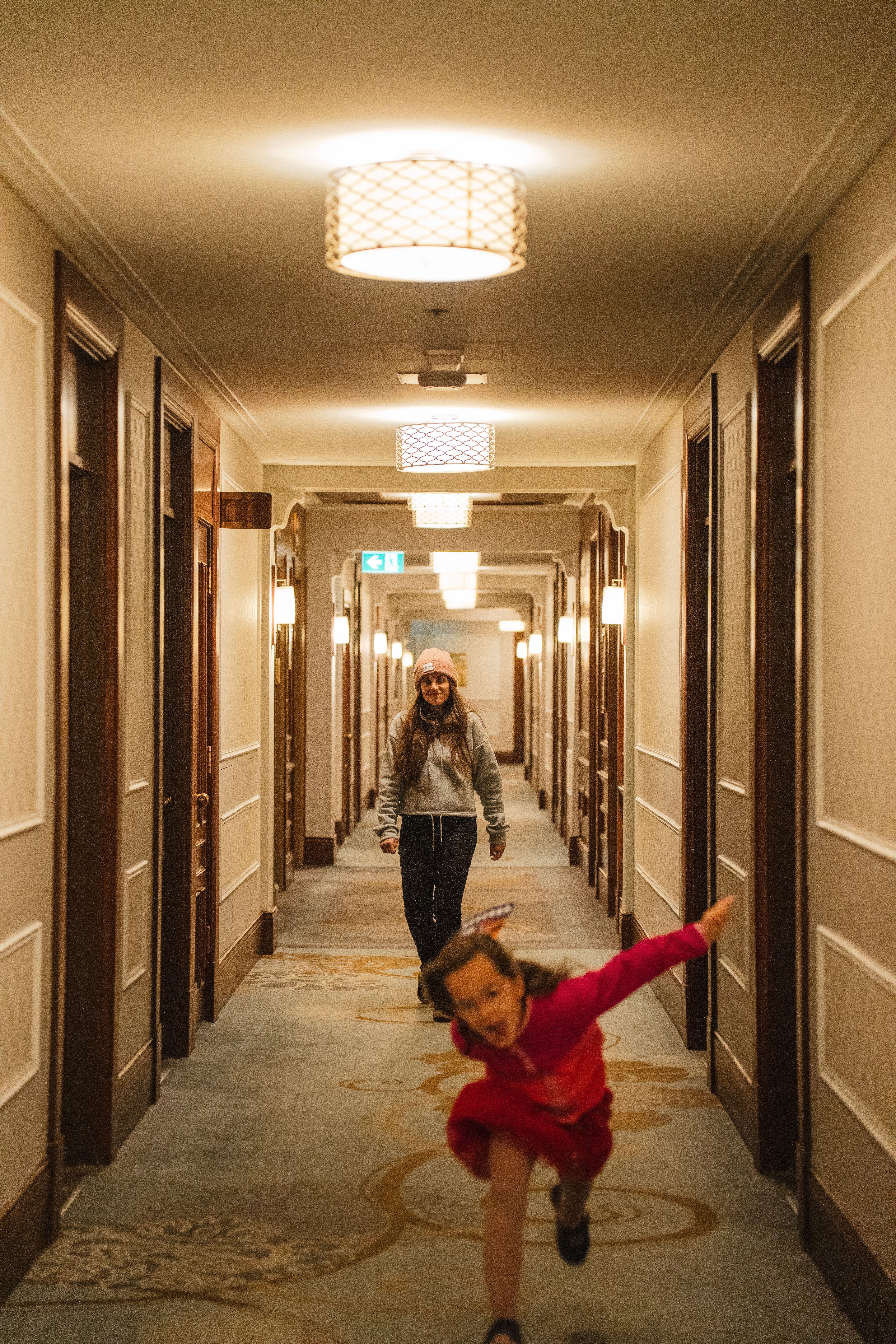 Children Playing in a Hotel Corridor · Free Stock Photo