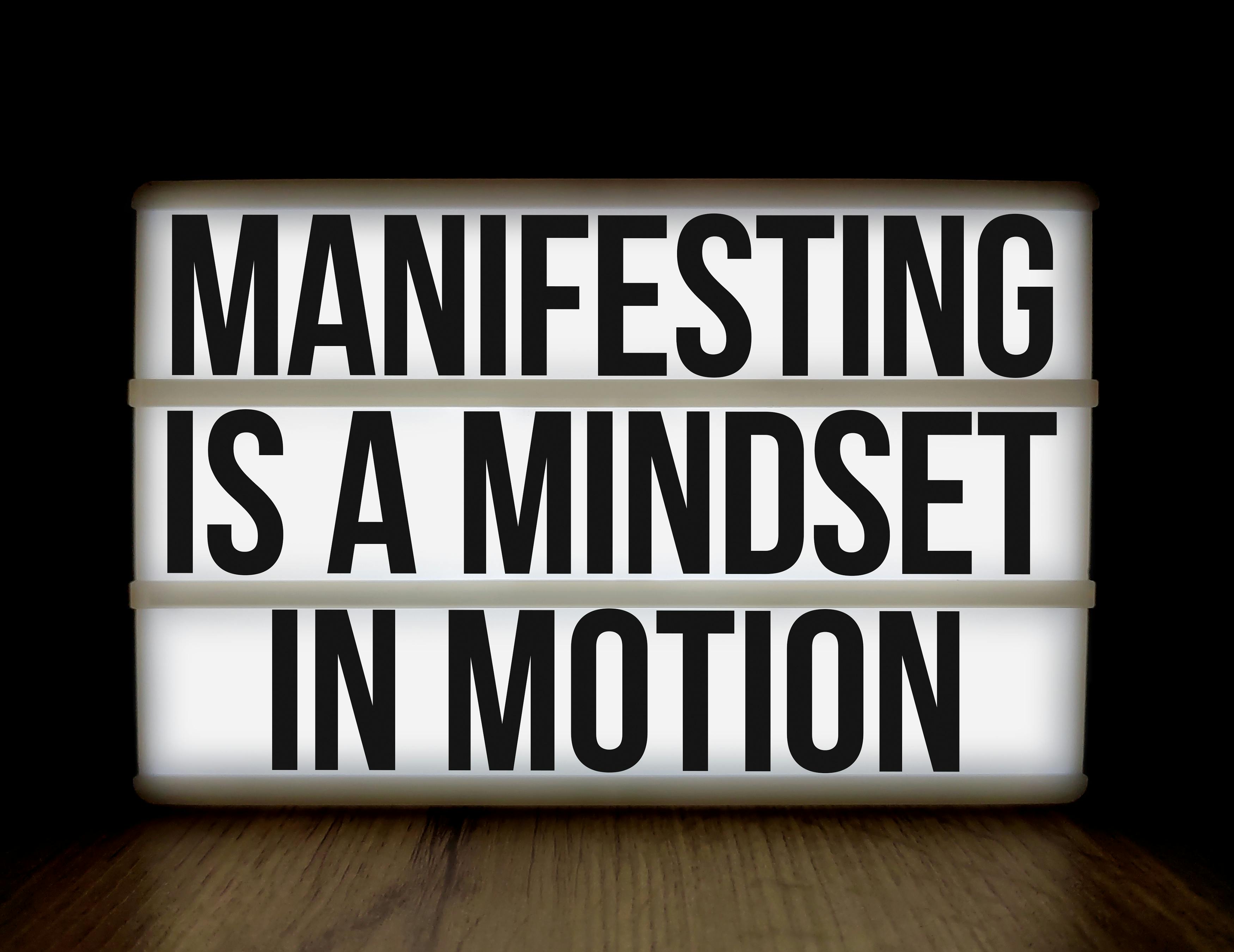 Inspirational Quote on Lightbox: Manifesting Mindset · Free Stock Photo