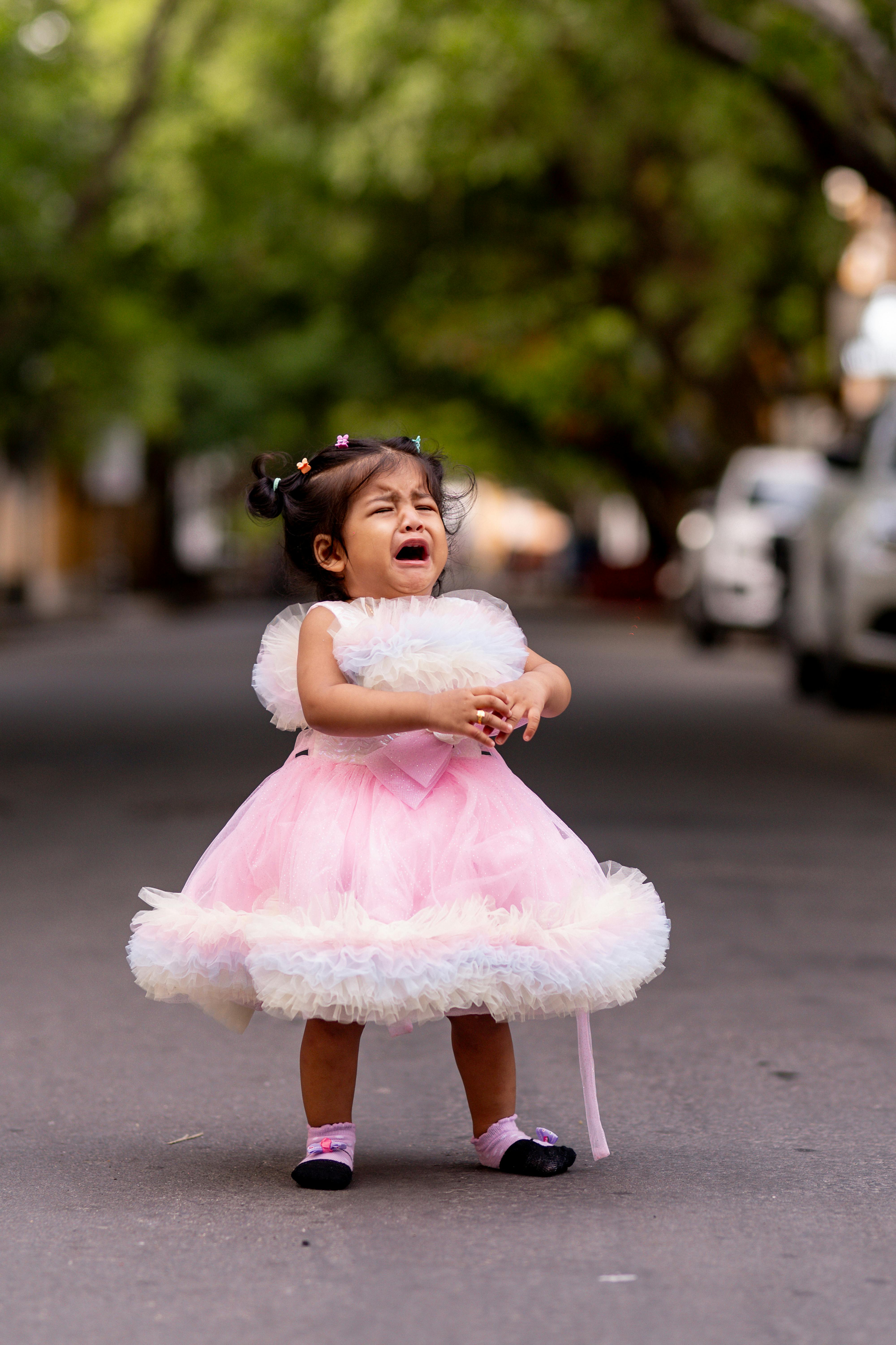 Crying Little Girl in Pink Dress on Street · Free Stock Photo