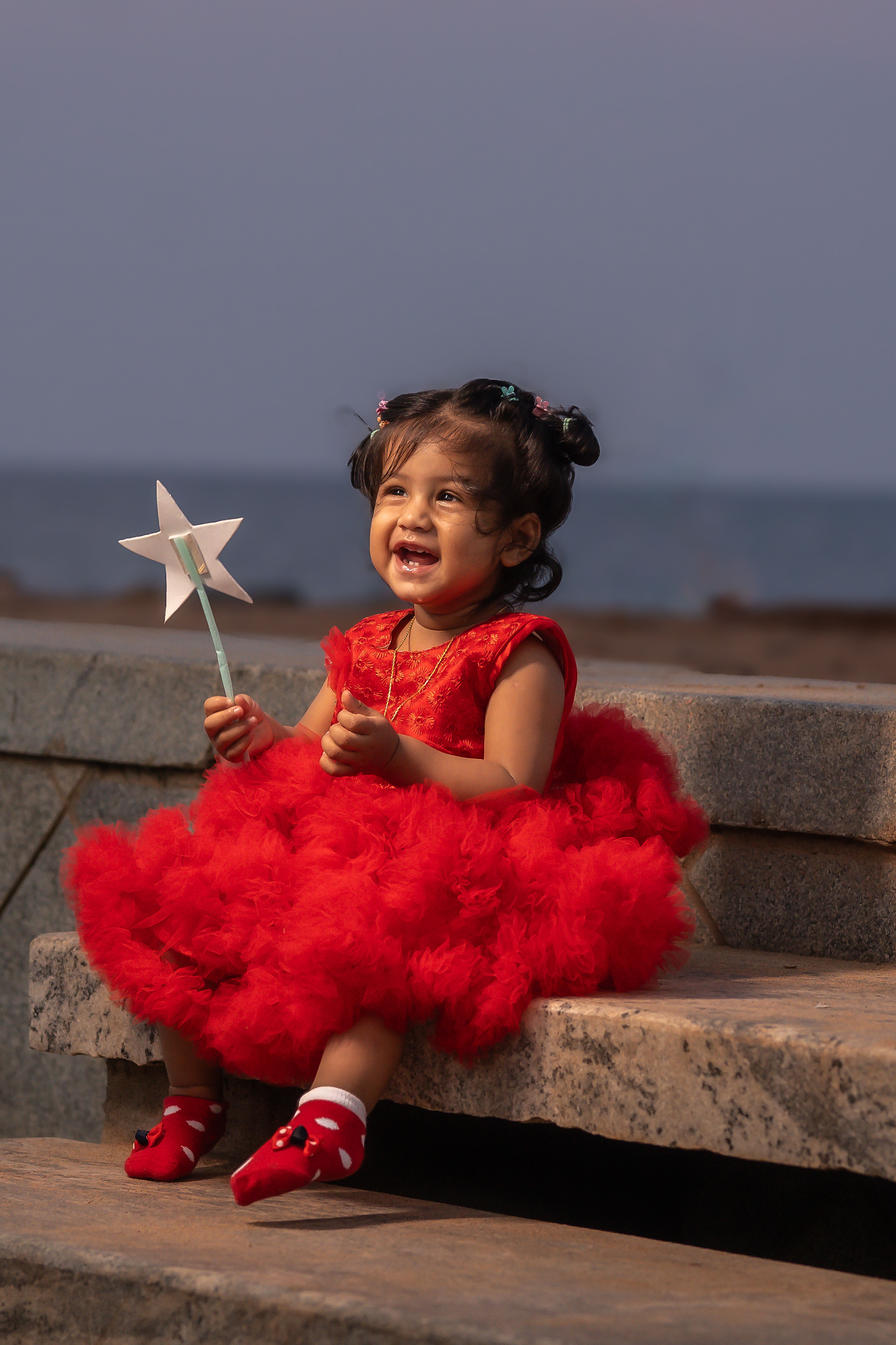 Joyful Child in Red Dress with Star Wand Outdoors · Free Stock Photo