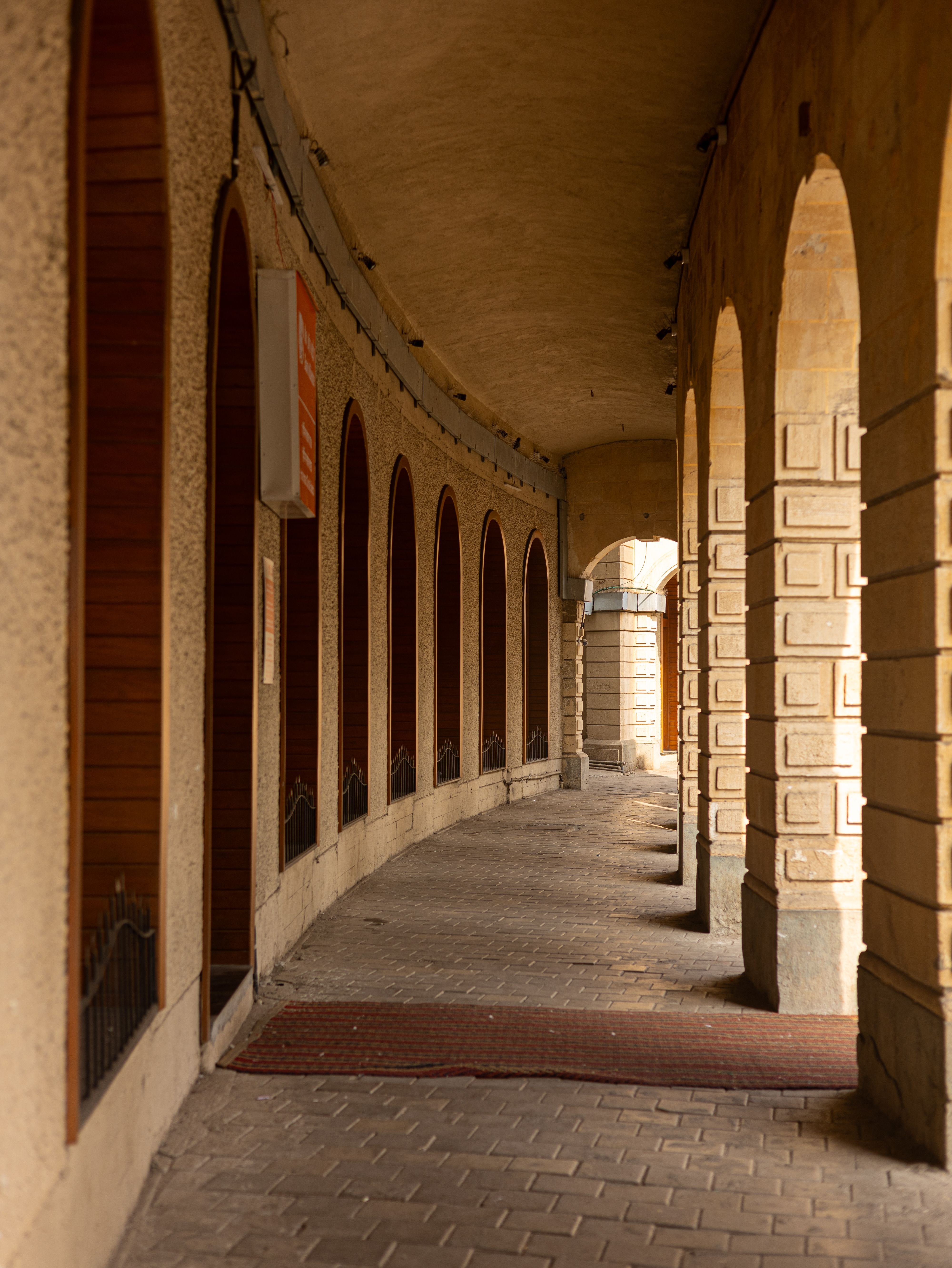 Arched Corridor in Historic Building · Free Stock Photo