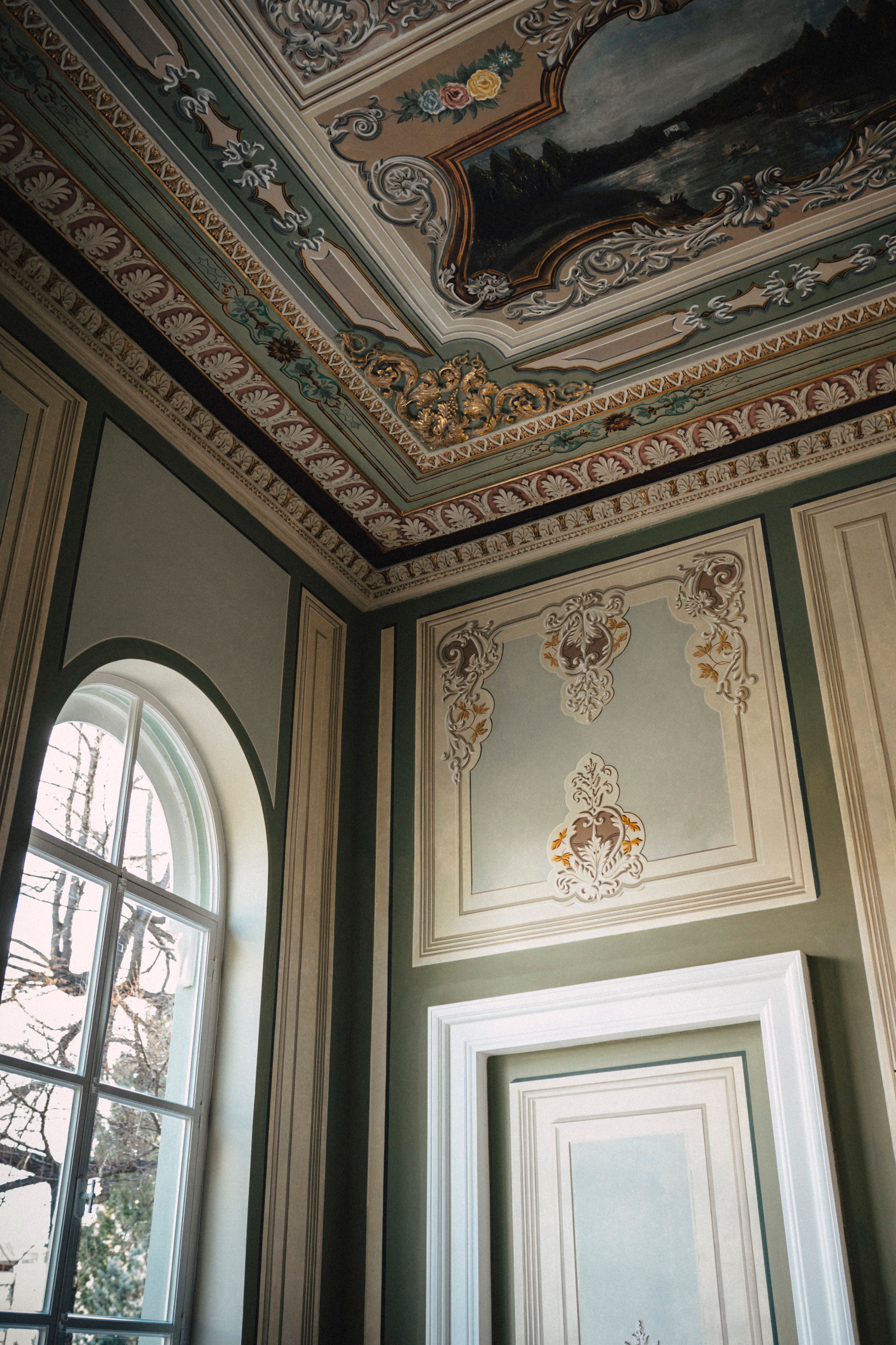 Ornate Ceiling and Window in Historical Building · Free Stock Photo