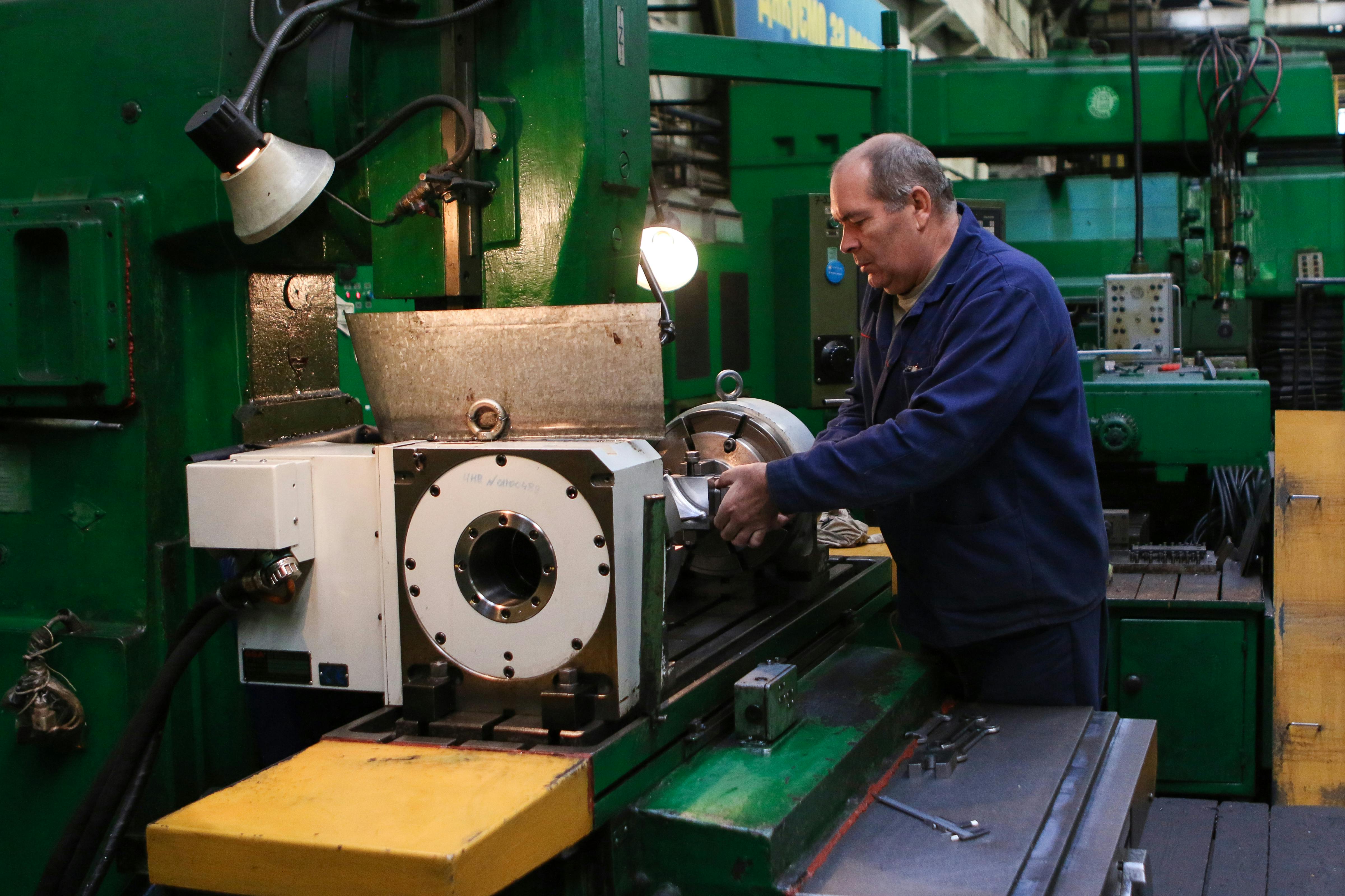 Man Operating A Machine · Free Stock Photo