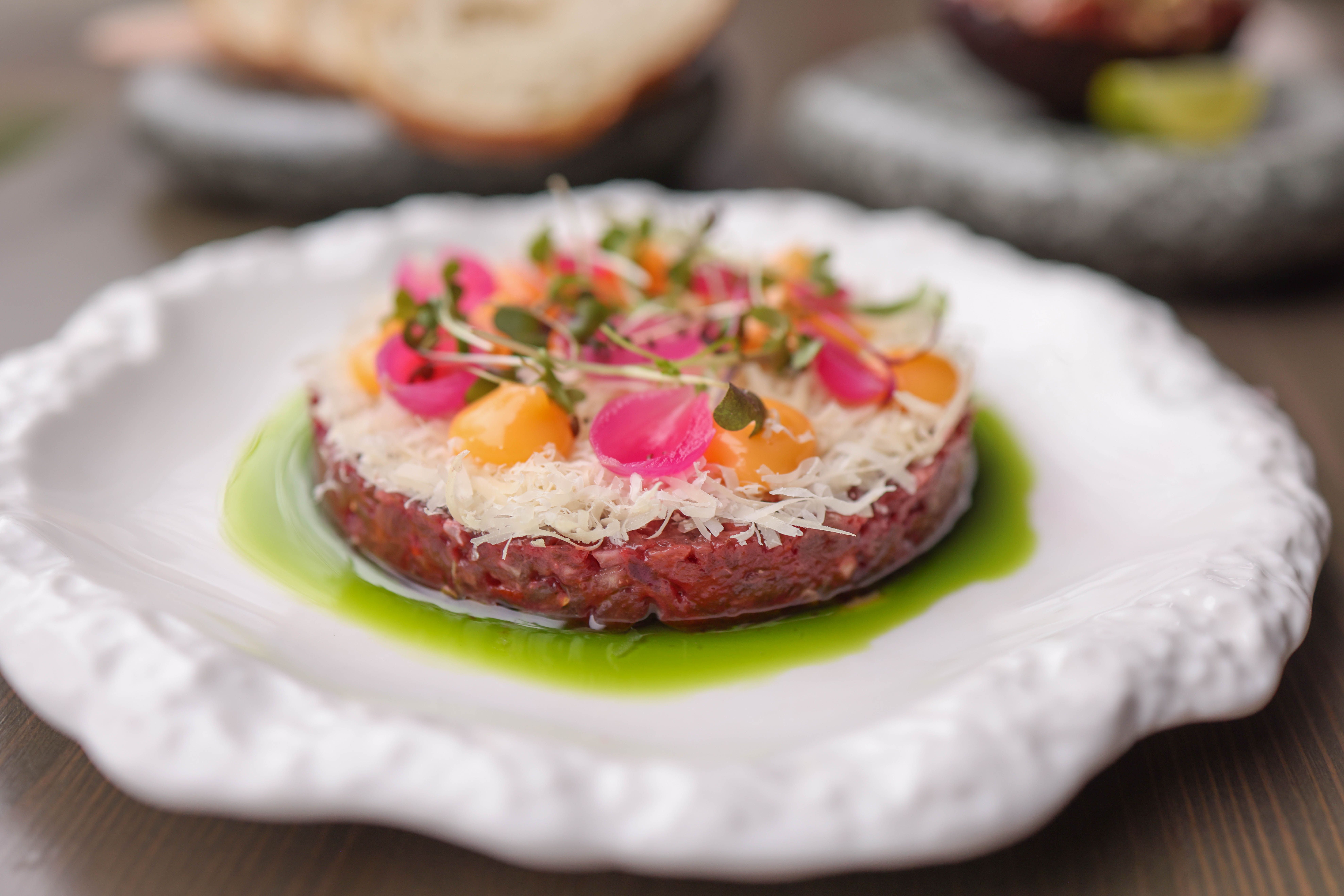 Gourmet Beef Tartare with Fresh Herbs and Vegetables · Free Stock Photo