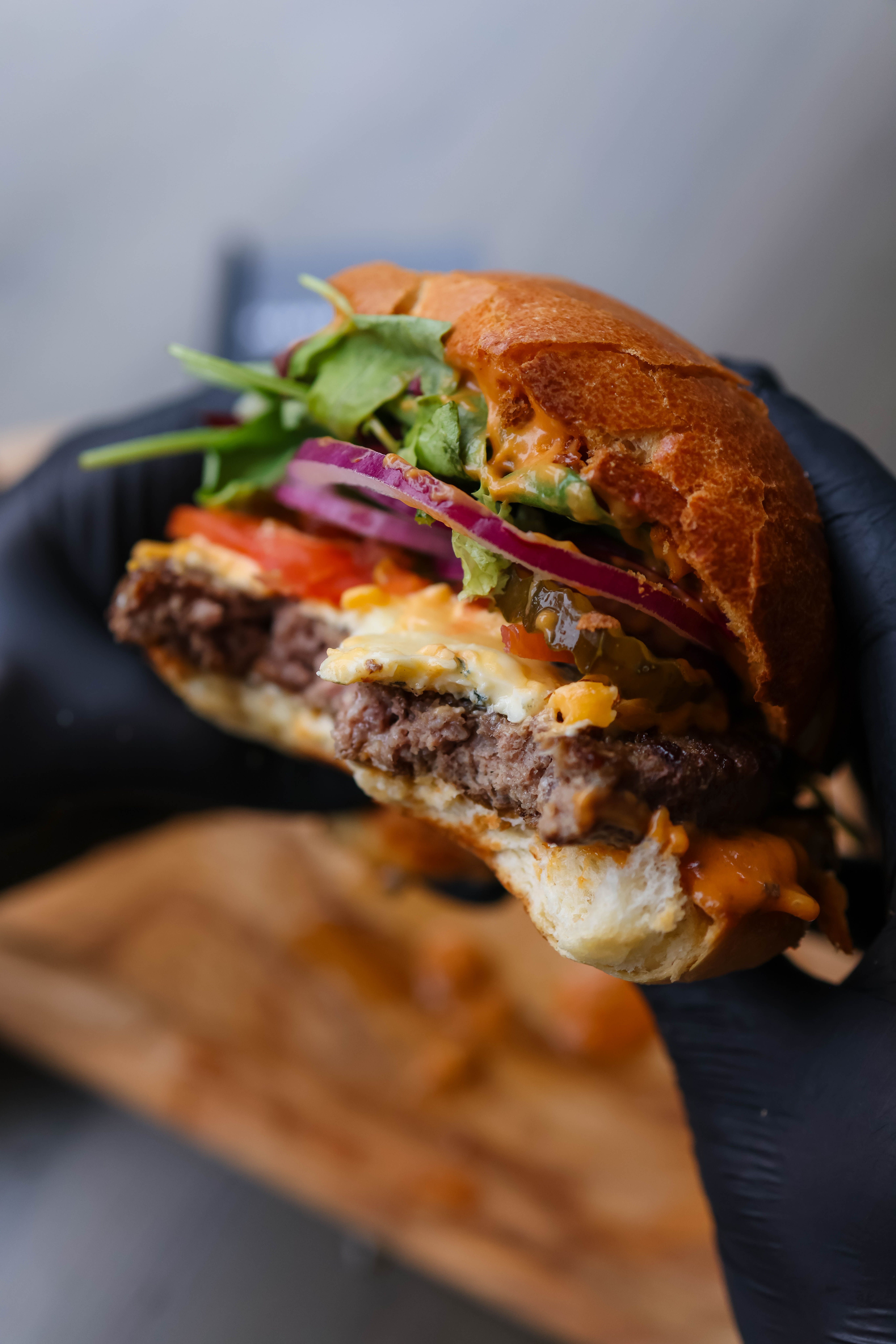 Juicy Gourmet Cheeseburger with Toppings · Free Stock Photo