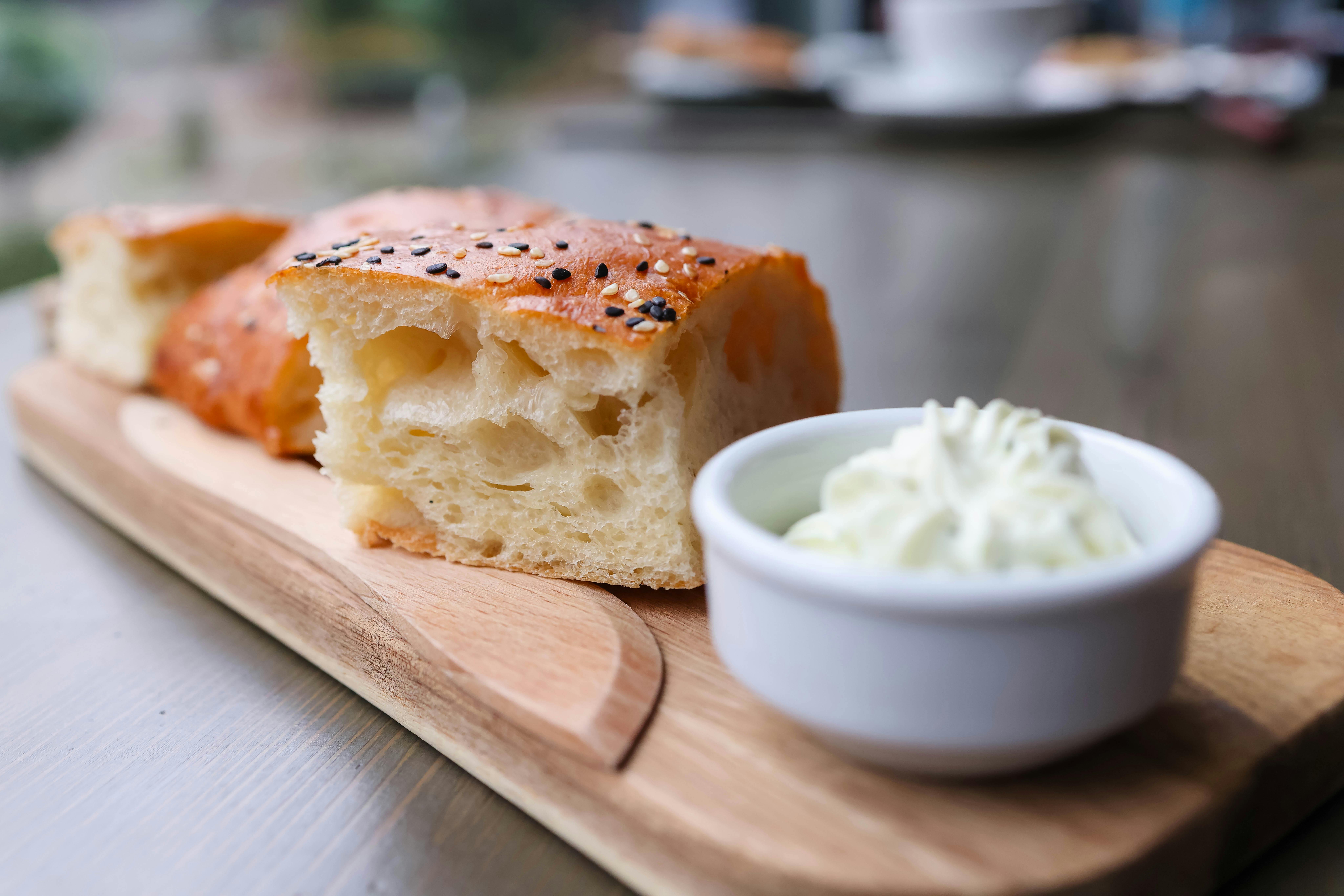 Close-up of Freshly Baked Focaccia with Cream · Free Stock Photo