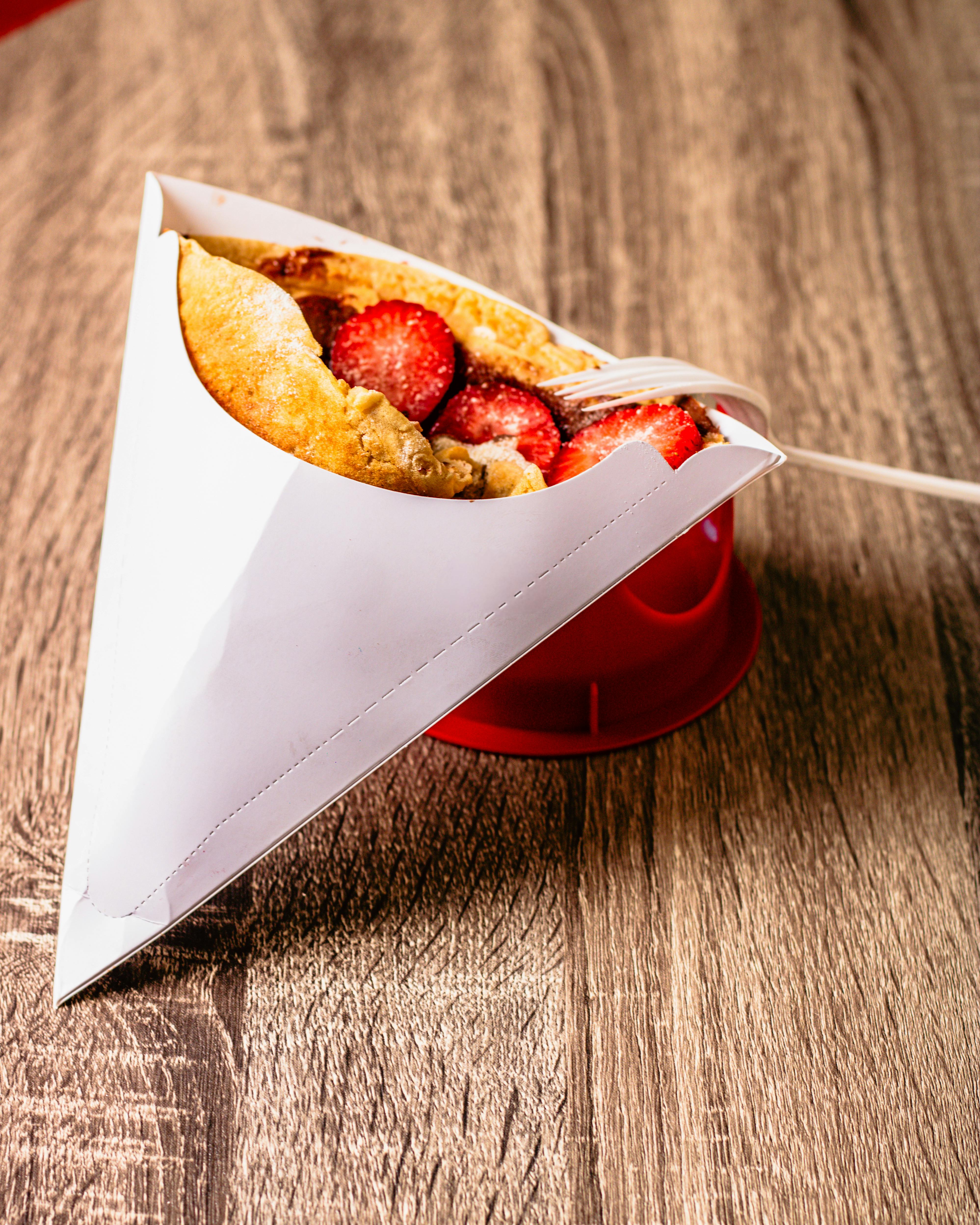 Delicious Strawberry Crepe in Paper Cone · Free Stock Photo