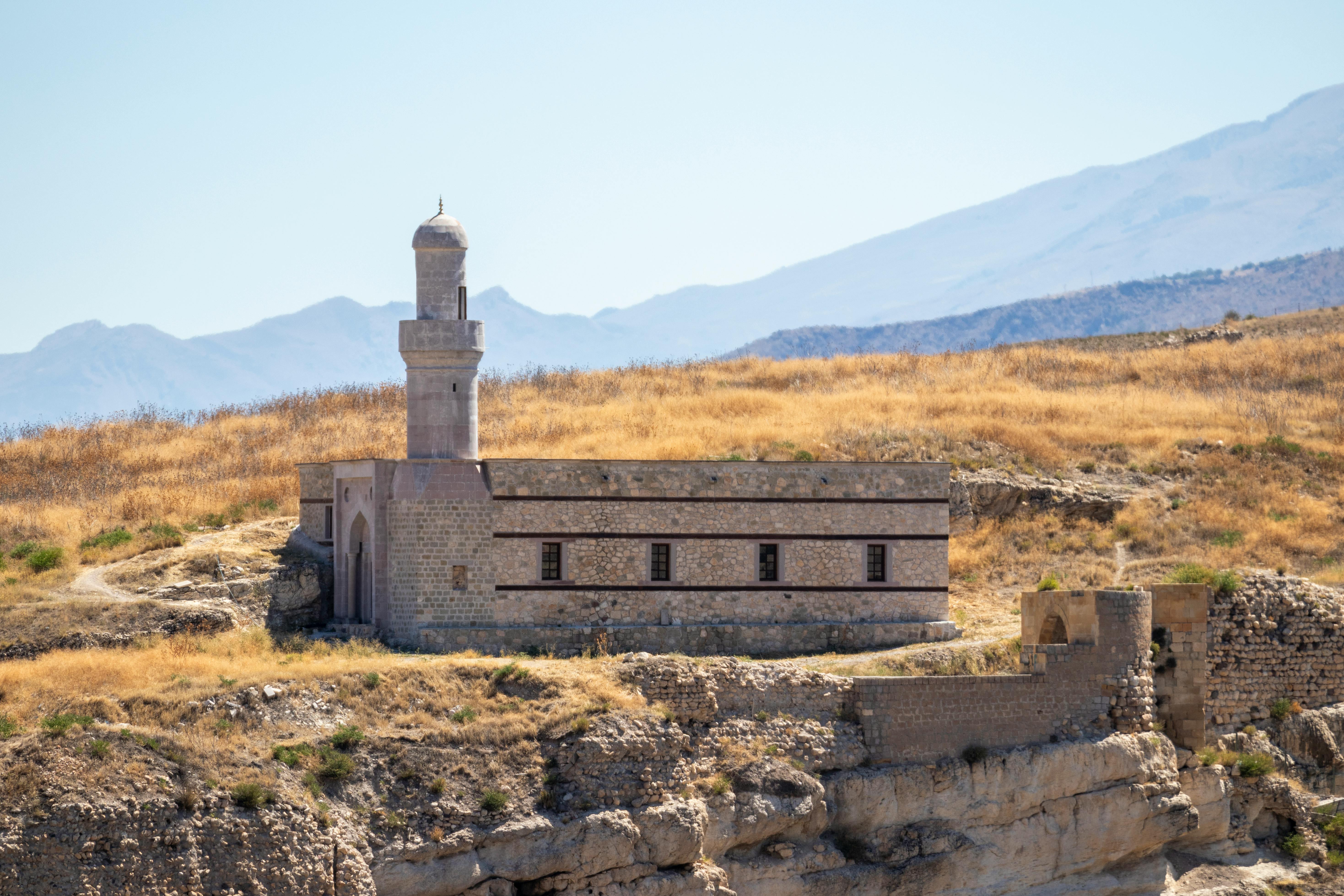 Historic Stone Mosque in Arid Landscape · Free Stock Photo