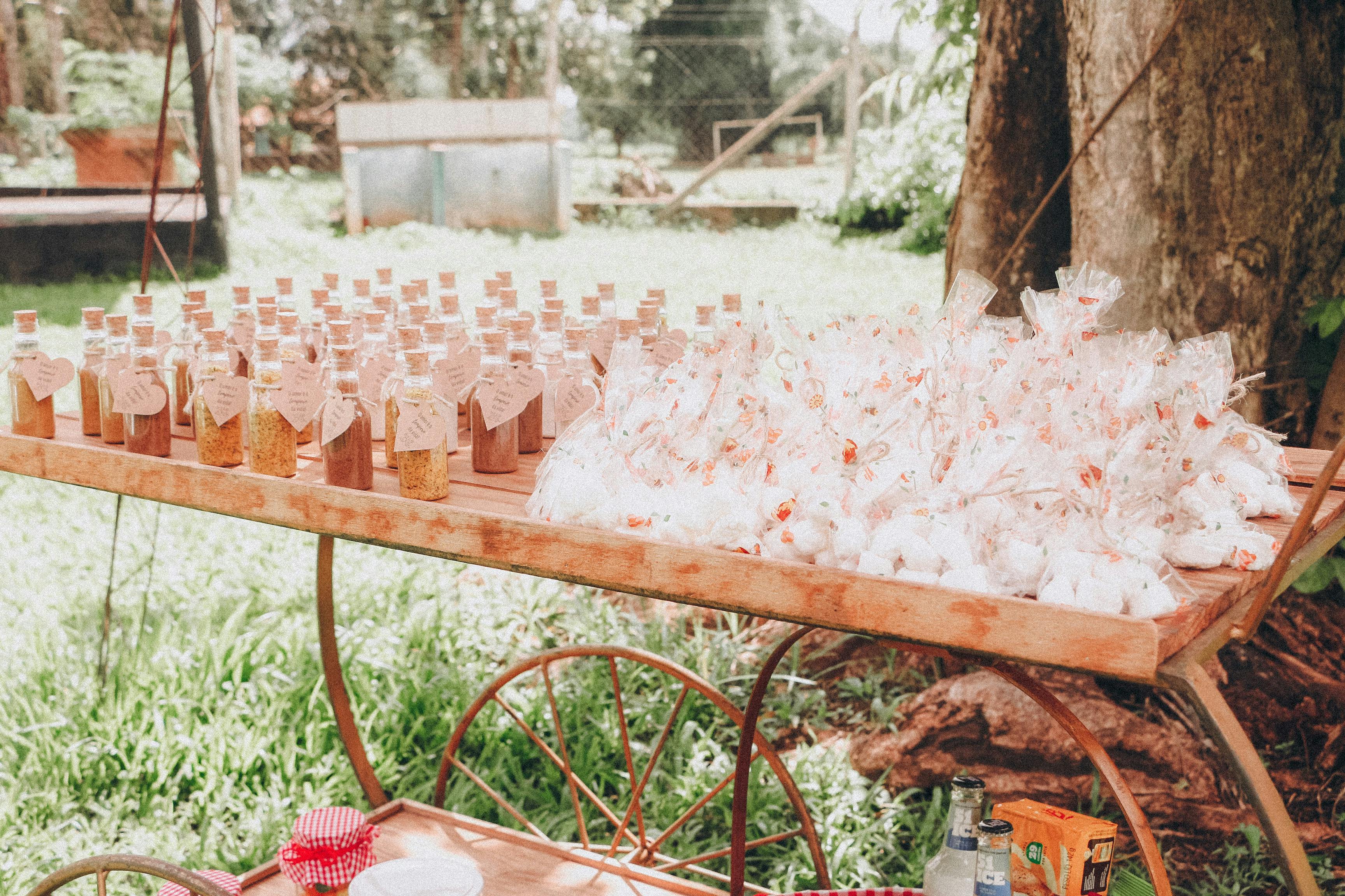 Outdoor Rustic Cart with Gift Bottles and Bags · Free Stock Photo