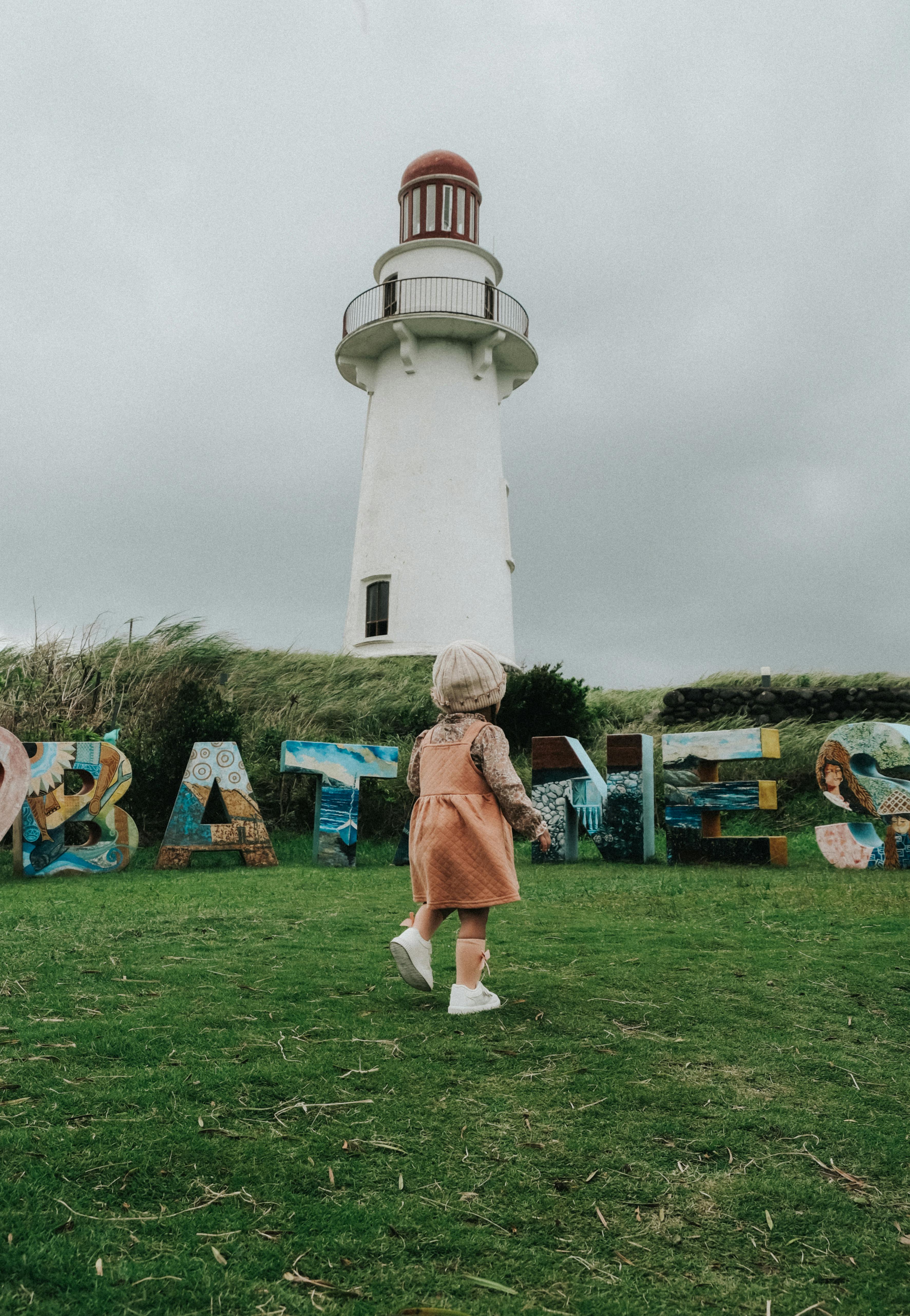 Child Exploring Basco Lighthouse in Batanes · Free Stock Photo