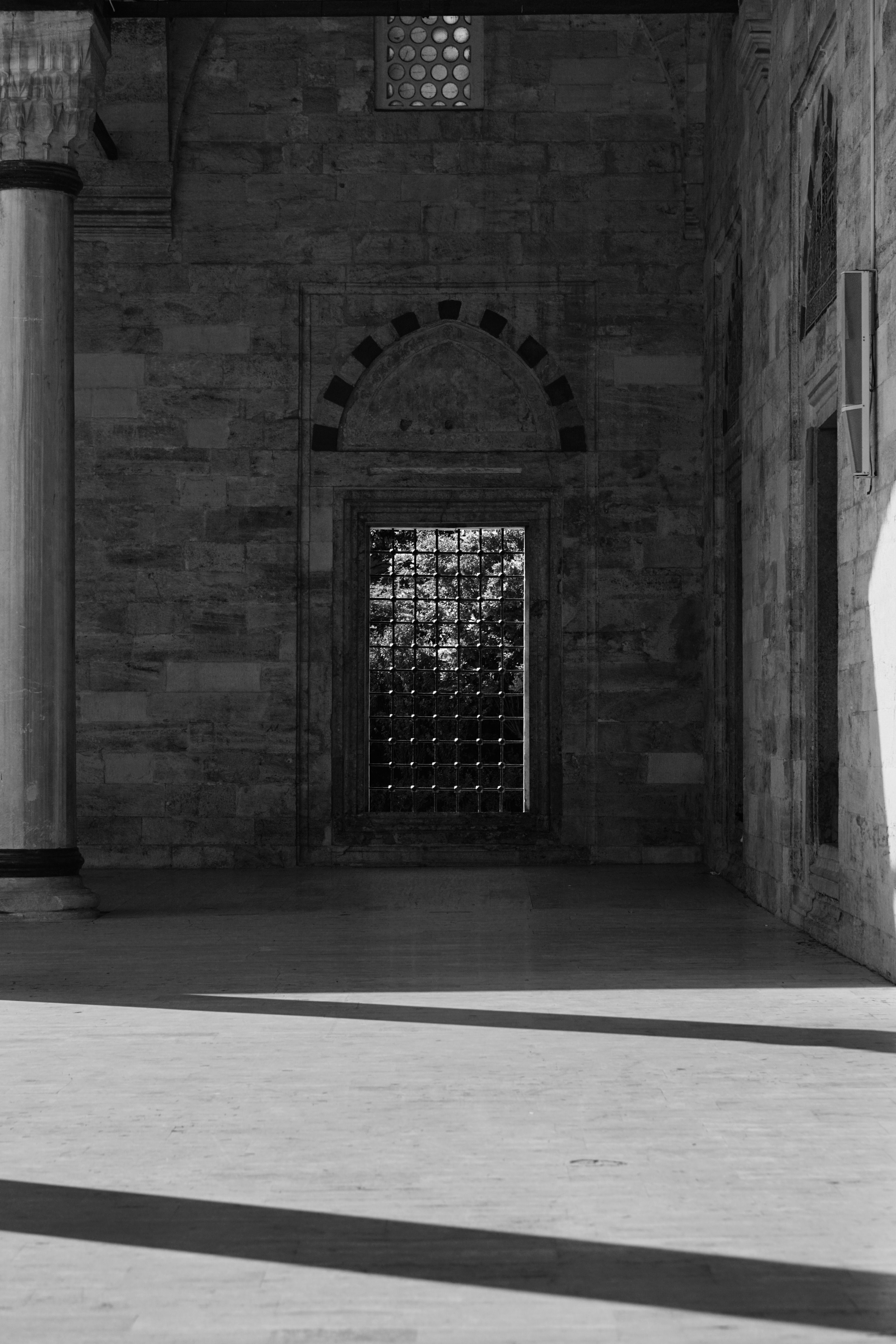 Arched Stone Architecture with Sunlit Shadows · Free Stock Photo
