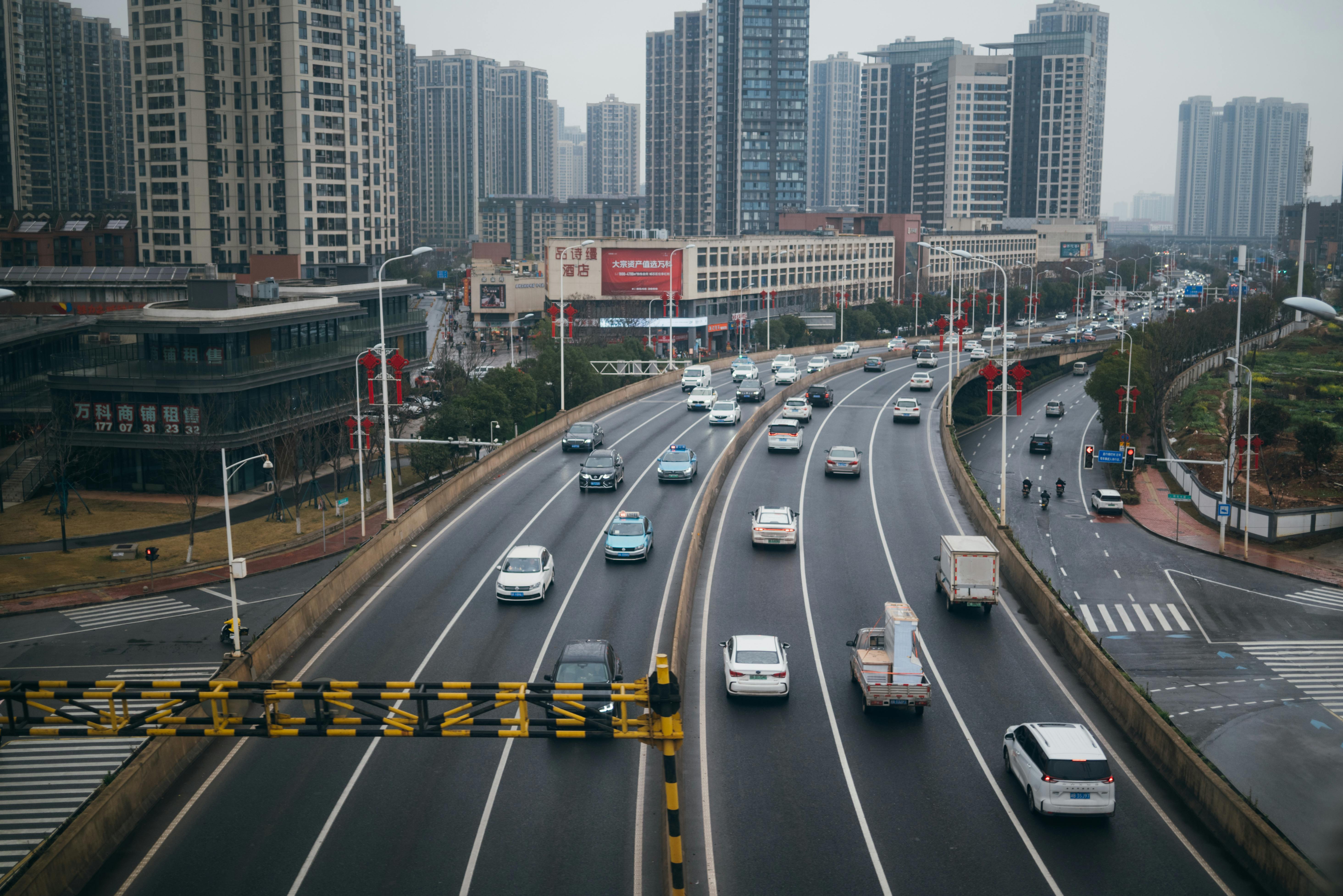 Urban Highway with High Rise Buildings and Traffic · Free Stock Photo