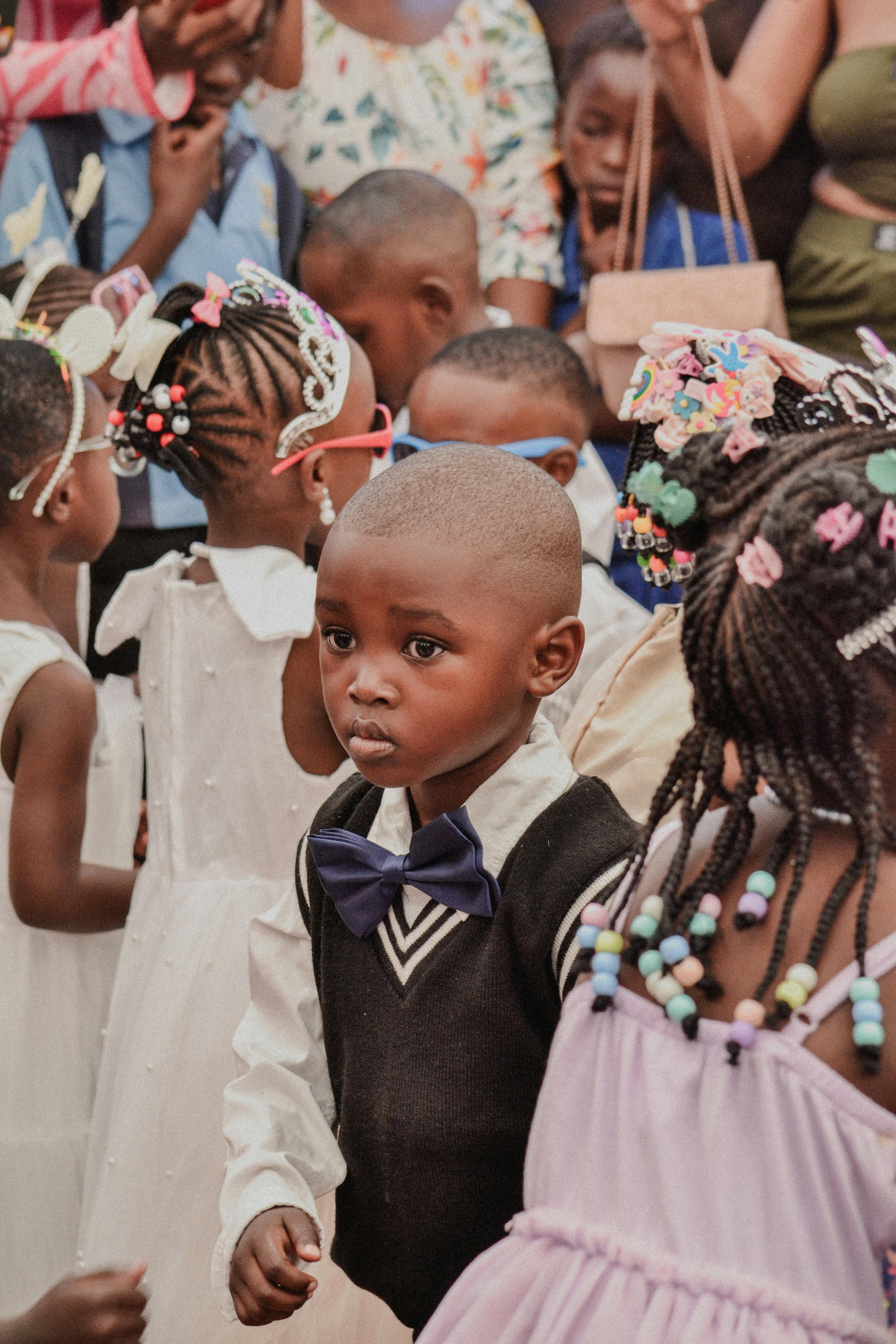 Children in Formal Attire at a Celebration · Free Stock Photo