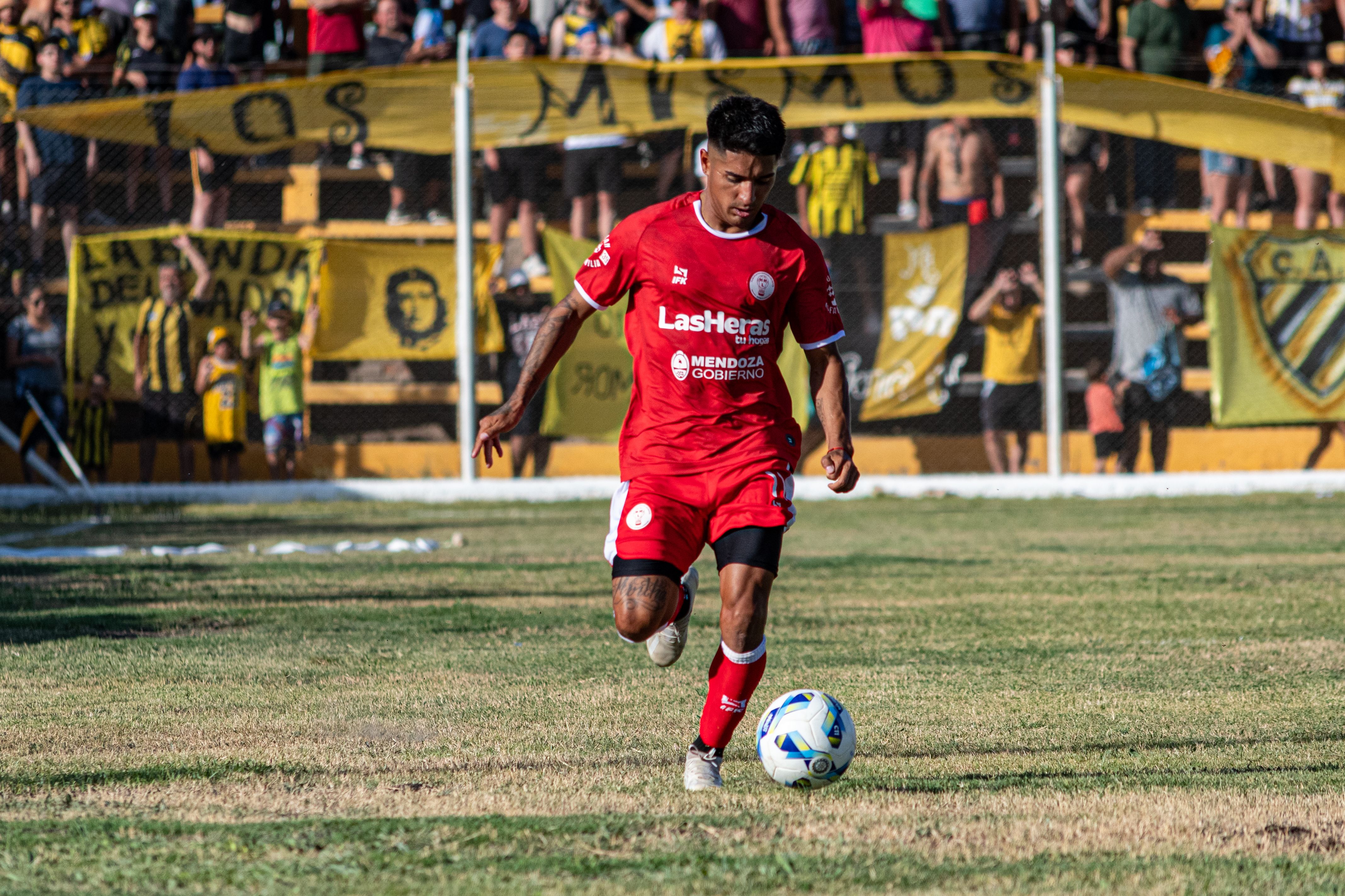 Soccer Player in Action During Daytime Match · Free Stock Photo