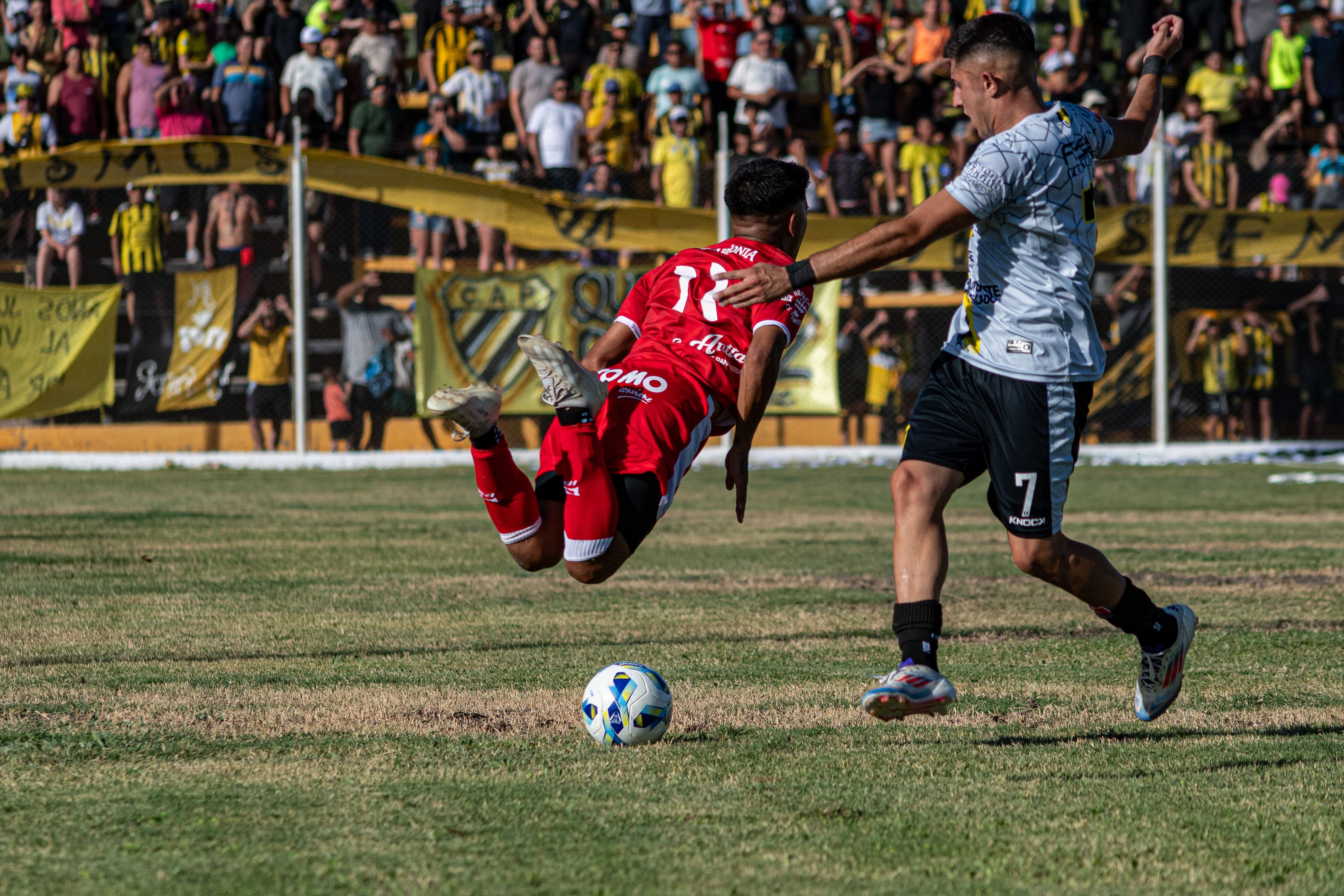 Intense Soccer Match Action with Players on Field · Free Stock Photo