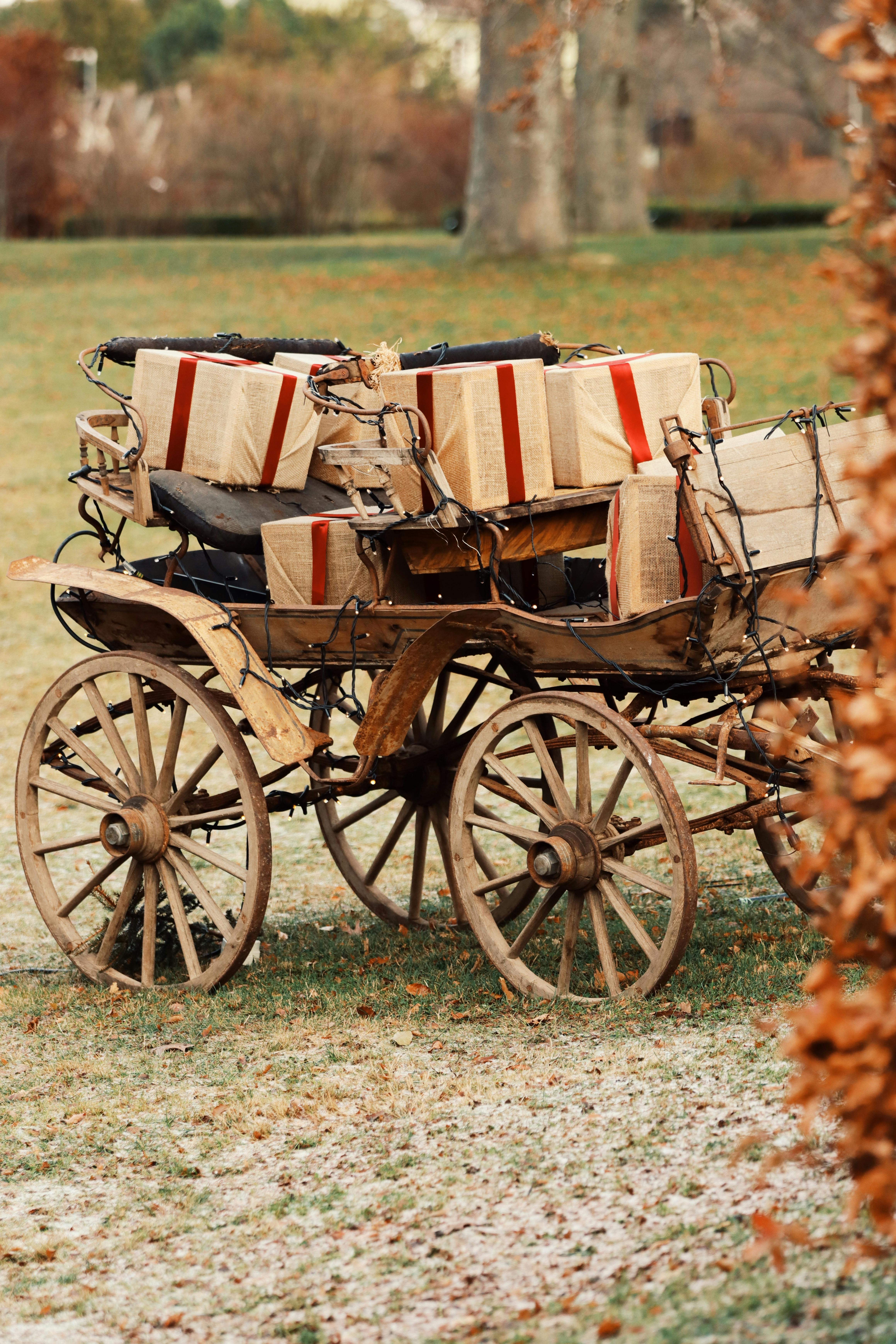 Antique Cart Filled with Wrapped Christmas Gifts Outdoors · Free Stock ...