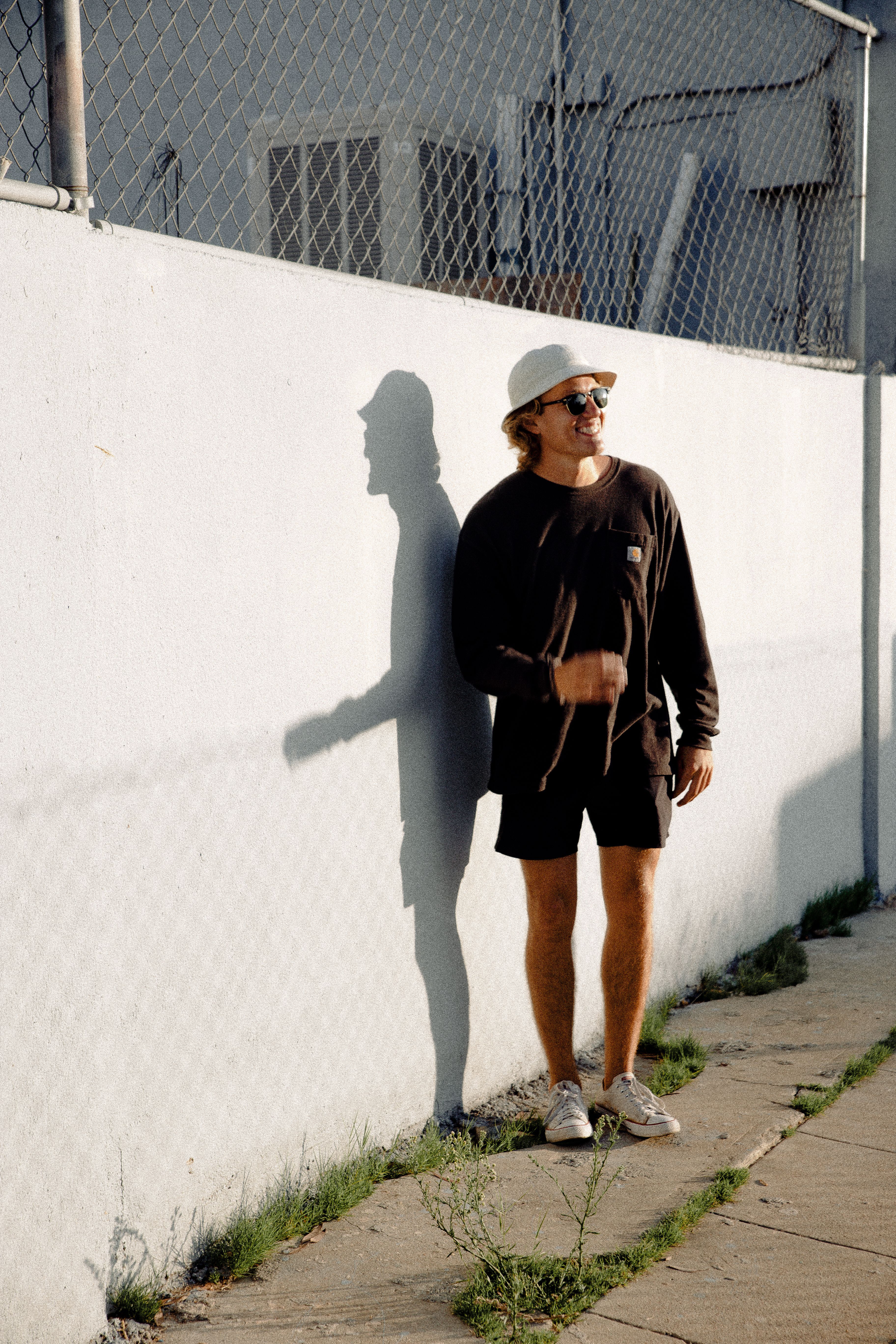 Man Near White Wall · Free Stock Photo