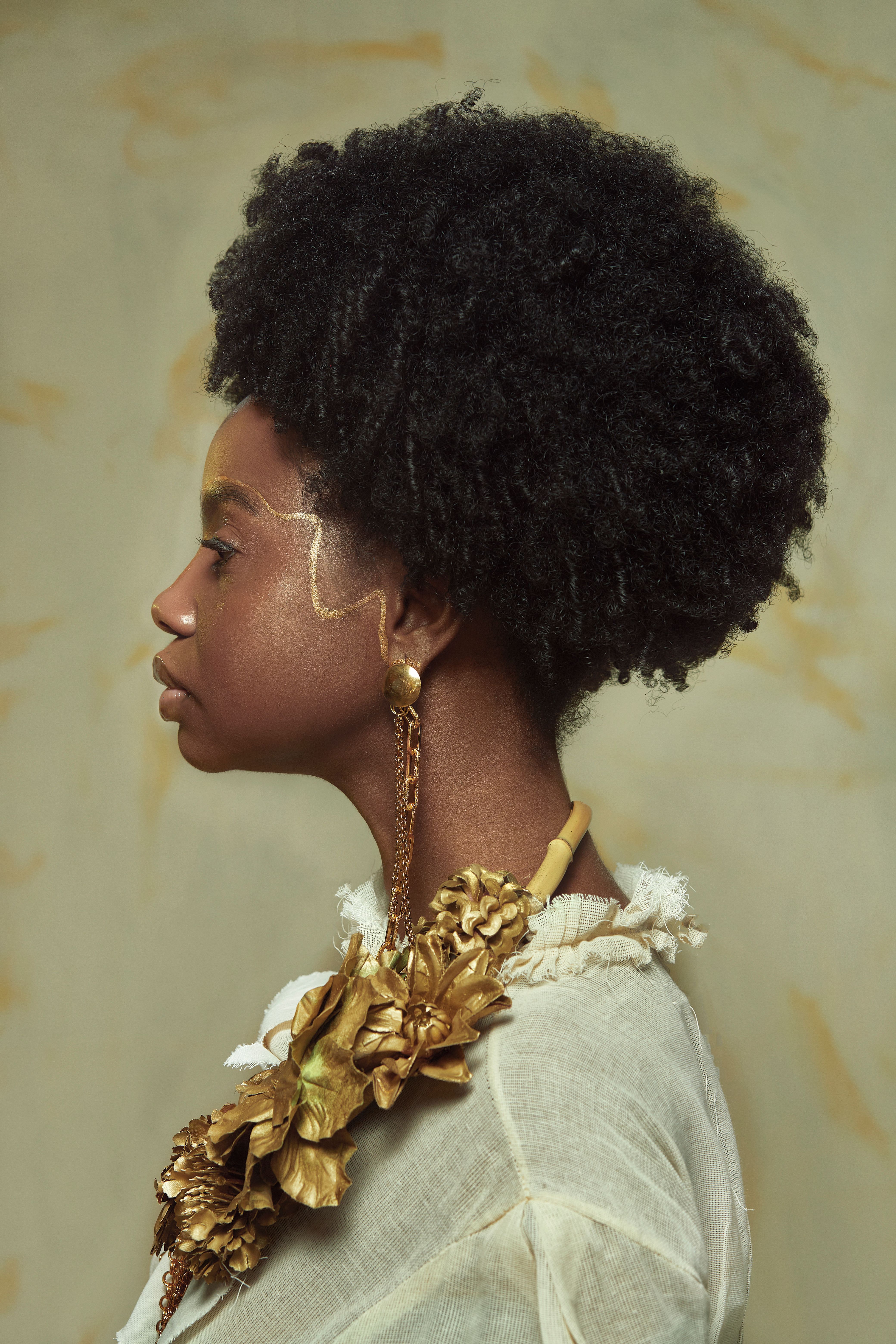 Elegant Profile Portrait with Unique Accessories · Free Stock Photo