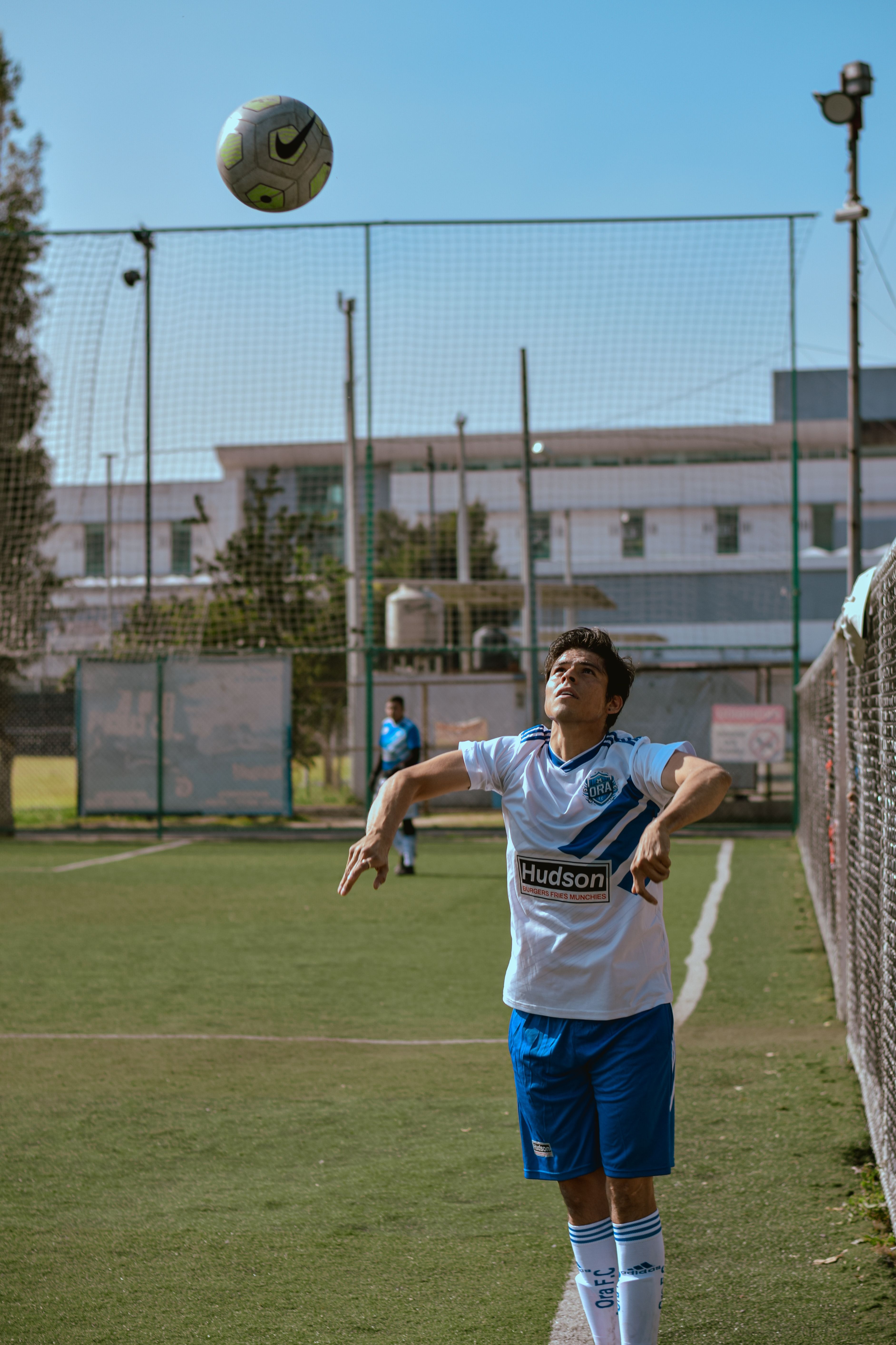 Young Soccer Player Preparing for Header Action Shot · Free Stock Photo