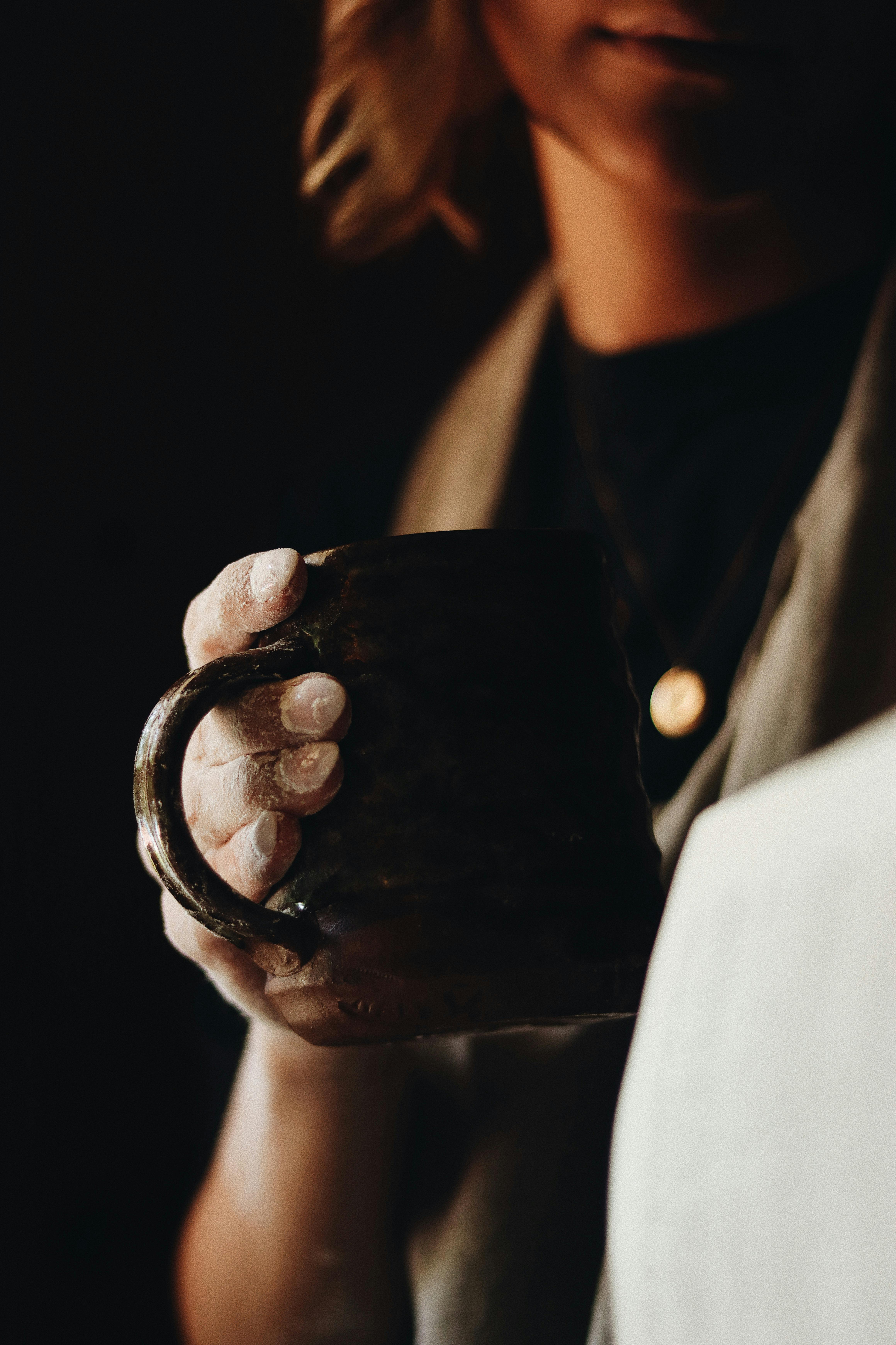 Cozy Indoor Coffee Moment with Flour-Dusted Hands · Free Stock Photo