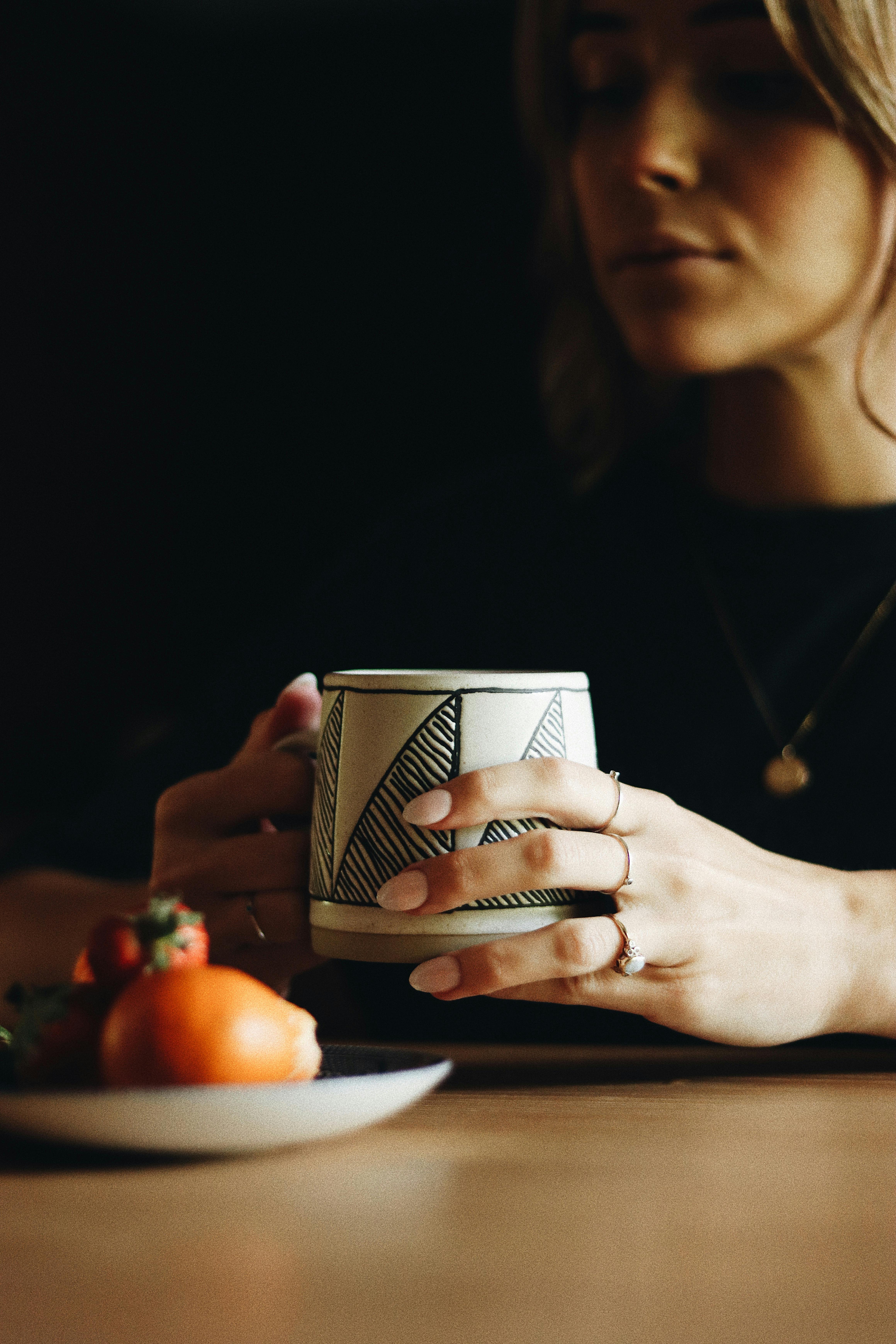 Contemplative Moment with Coffee Mug Indoors · Free Stock Photo