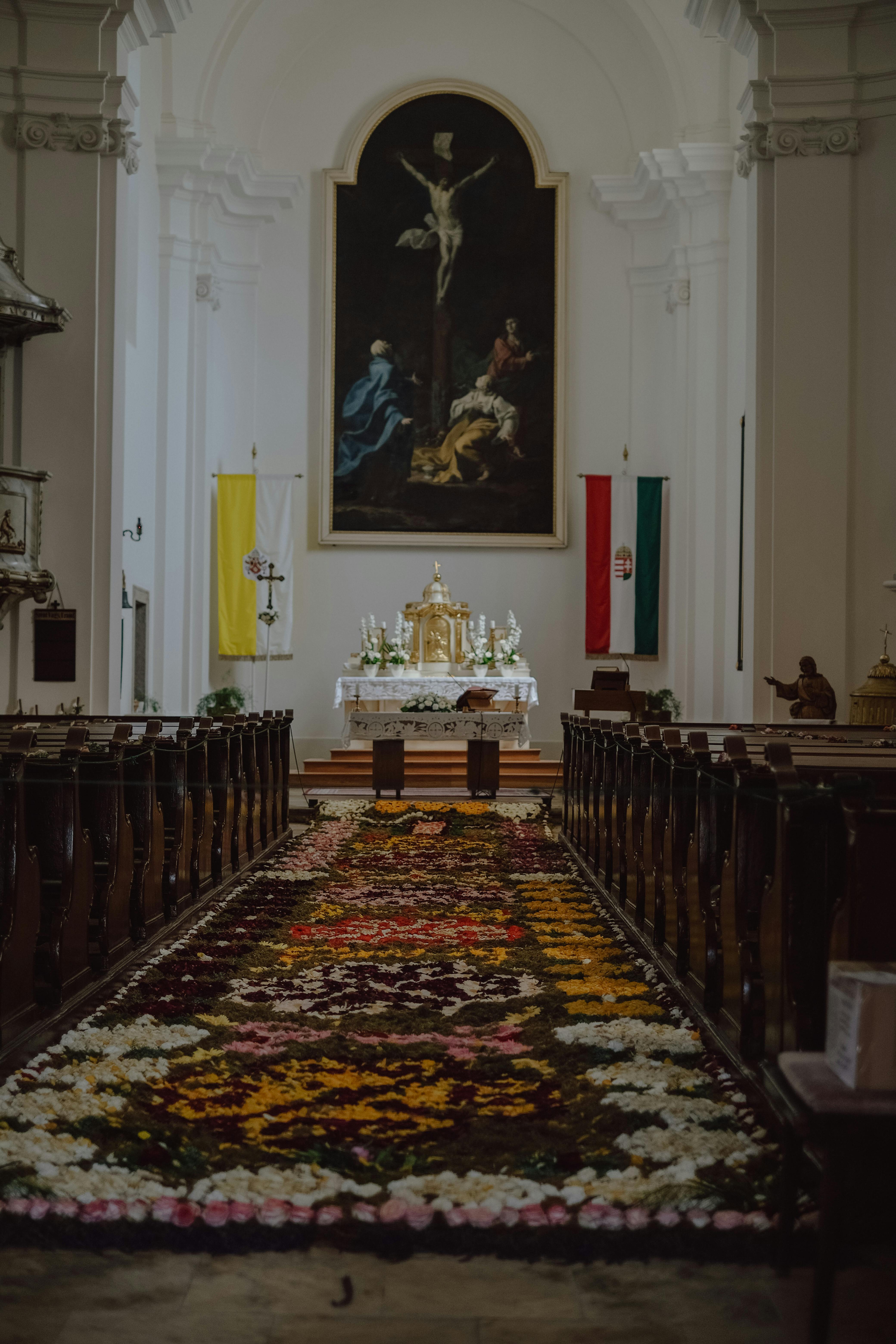 Elegant Church Interior with Floral Carpet and Altar · Free Stock Photo