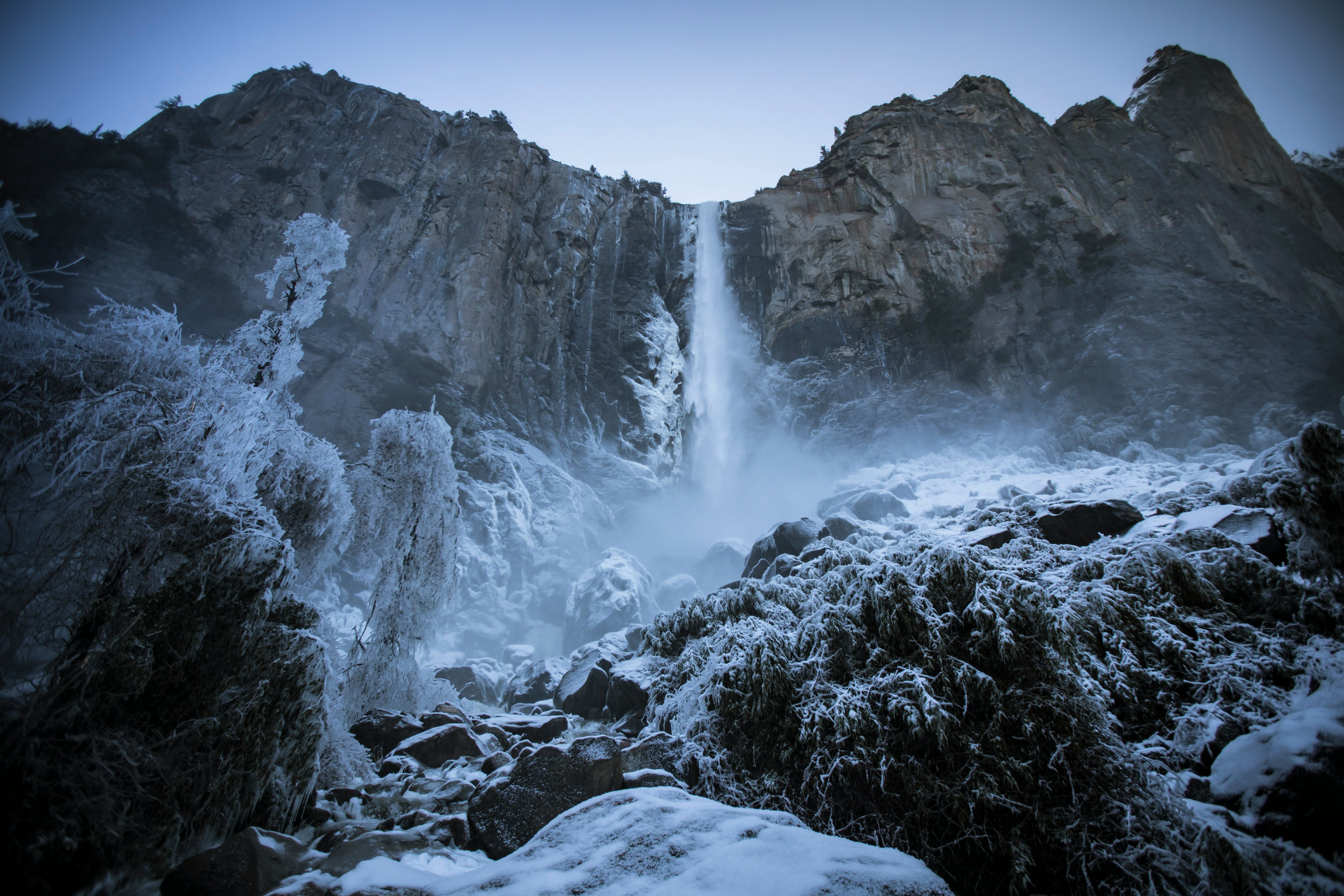 Majestic Winter Waterfall in Icy Landscape · Free Stock Photo