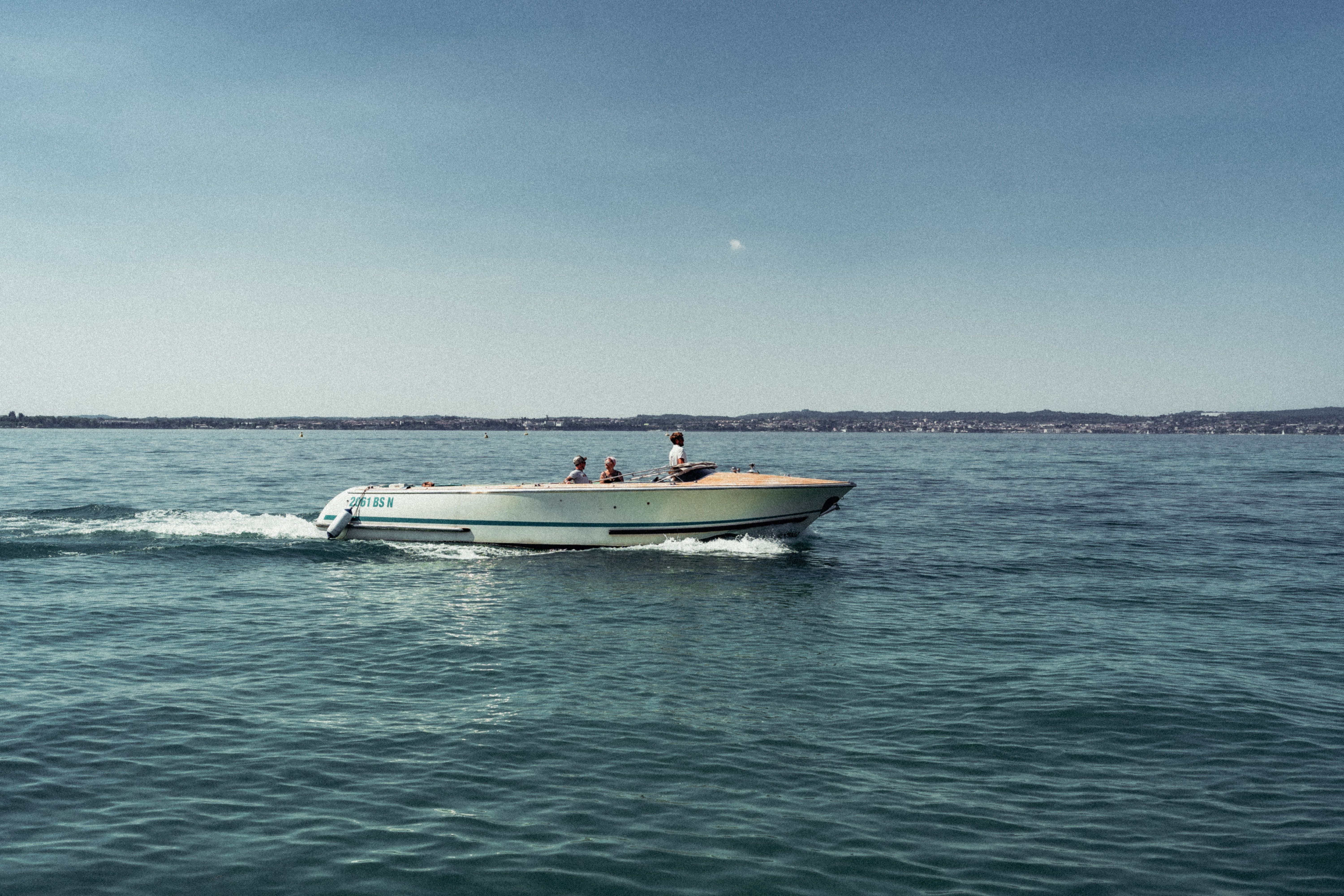 Scenic Boat Ride Across Serene Lake Waters · Free Stock Photo