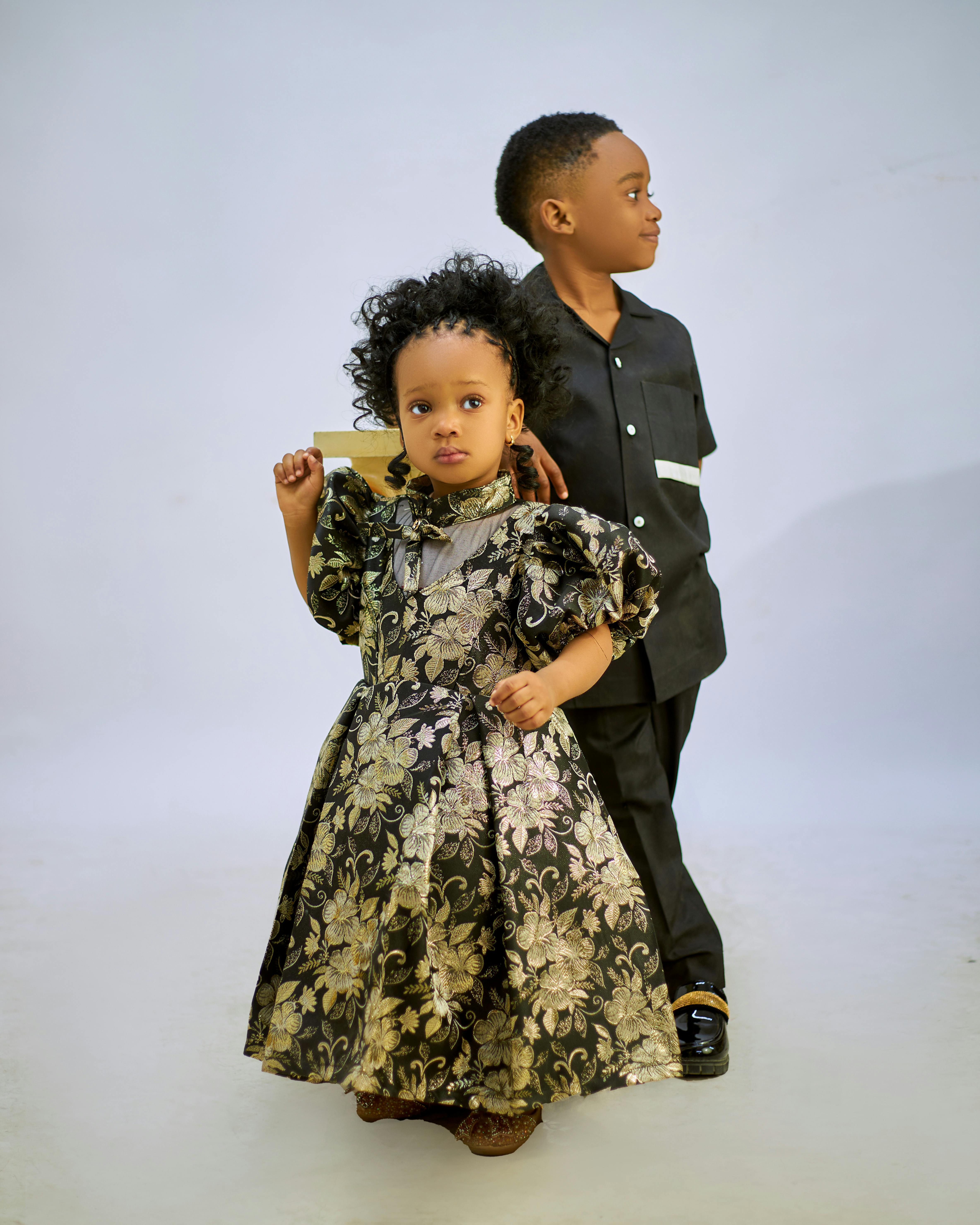 Elegant Children in Formal Attire Studio Portrait · Free Stock Photo