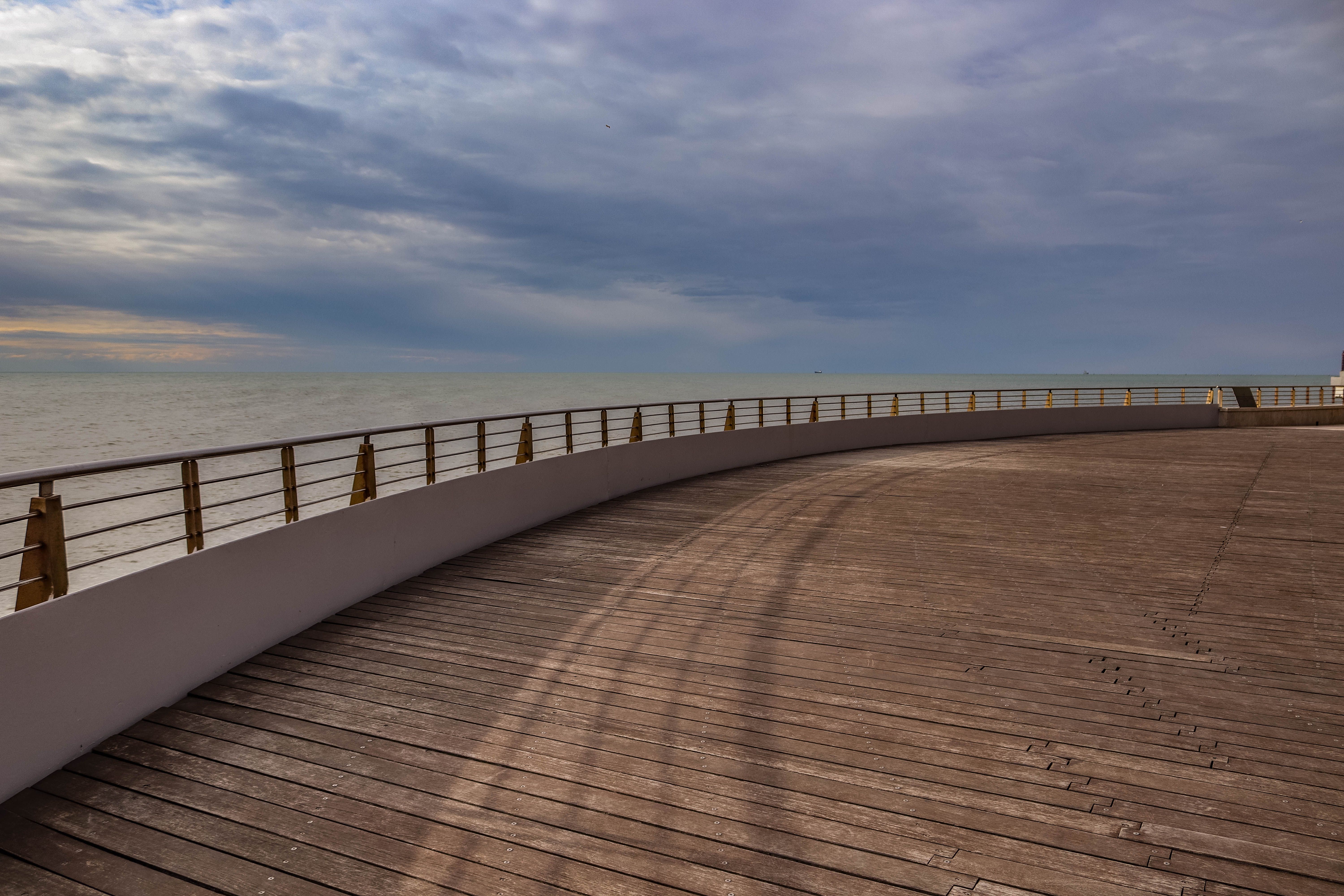 Scenic Ocean View from Wooden Deck with Railings · Free Stock Photo