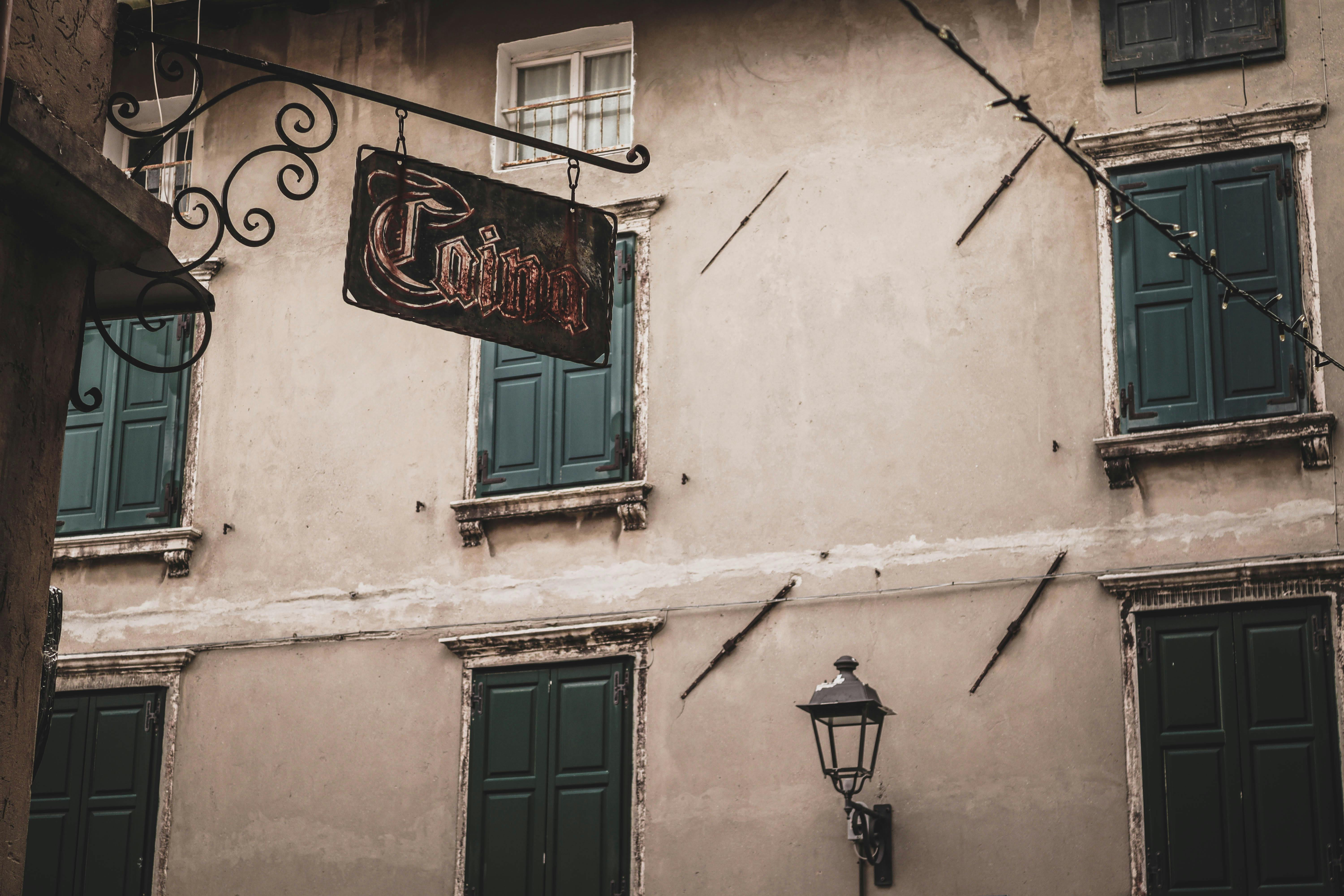 Vintage Street Sign on Historic Building · Free Stock Photo